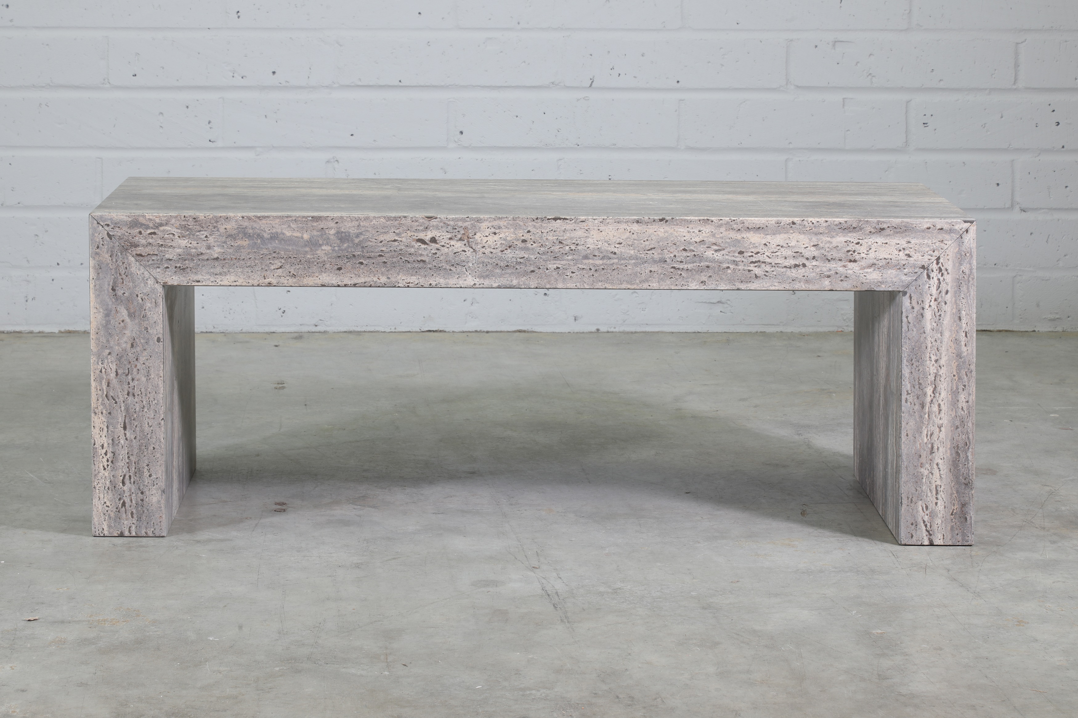 Lot 556 - A contemporary travertine bench,