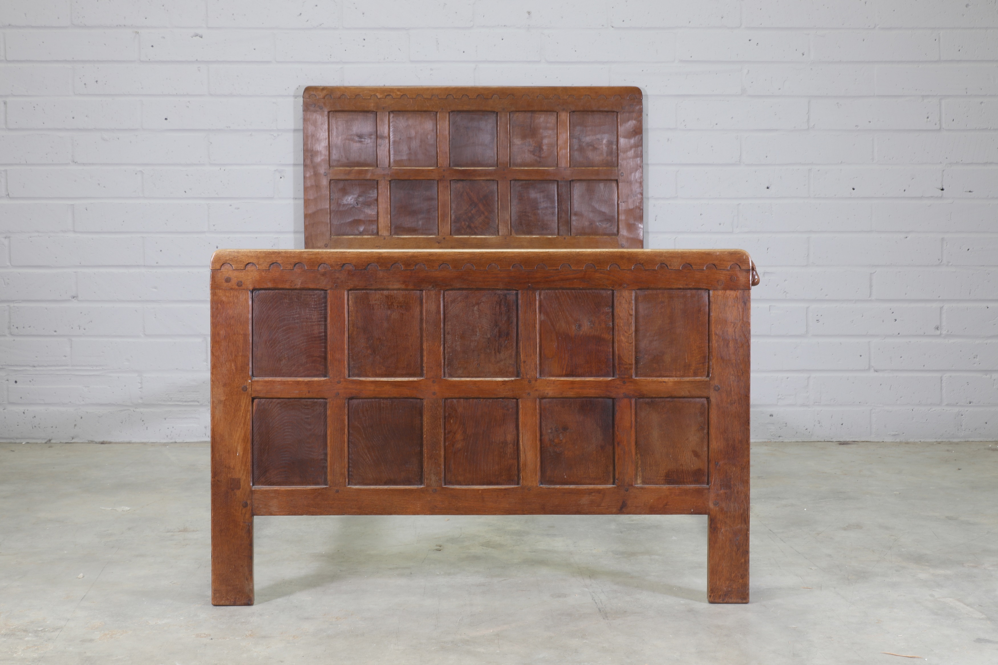 Lot 161 - A Robert 'Mouseman' Thompson oak bed frame,