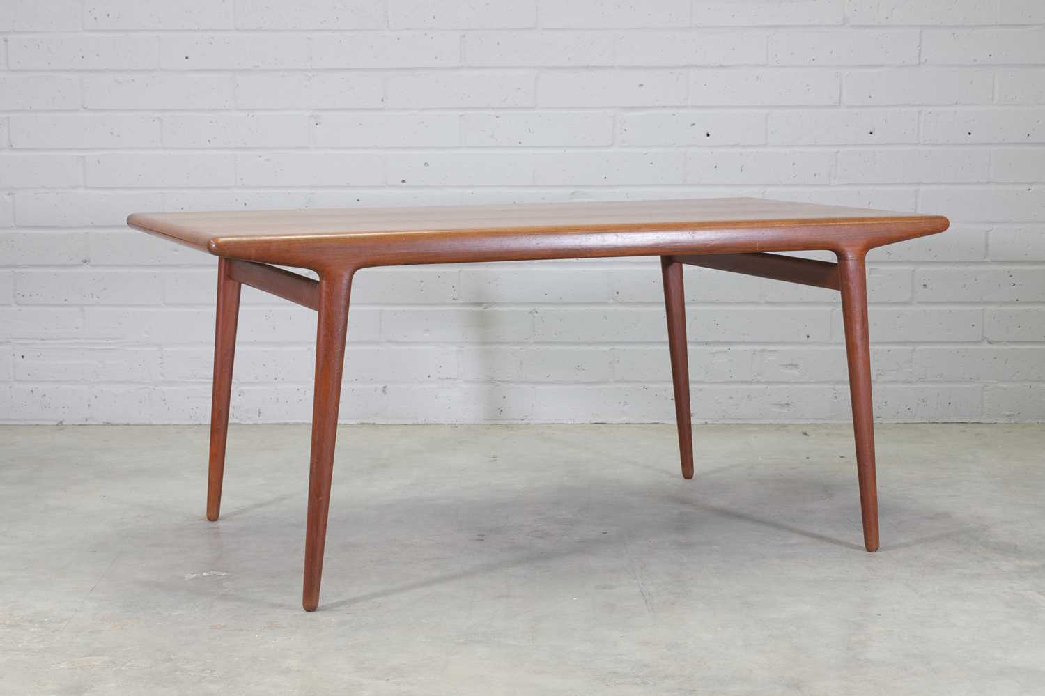 Lot 367 - A Danish teak extending dining table,