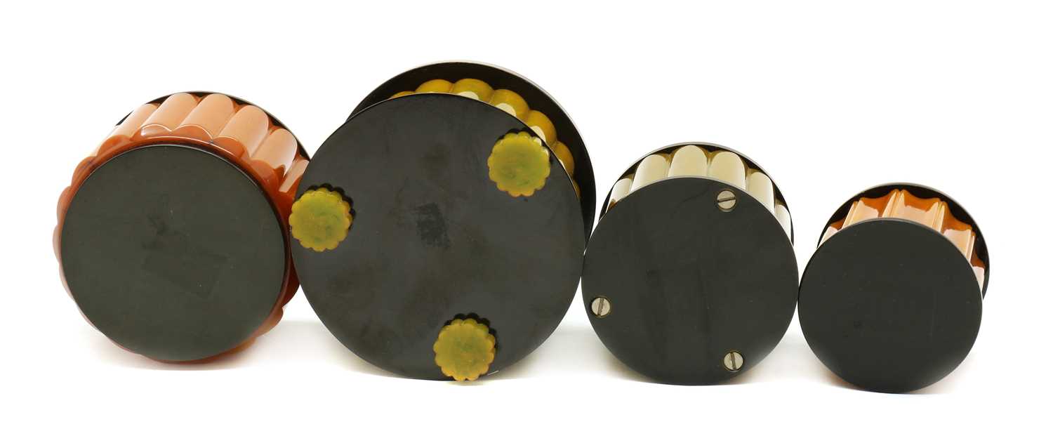 Lot 333 - Four Art Deco bakelite jars and covers