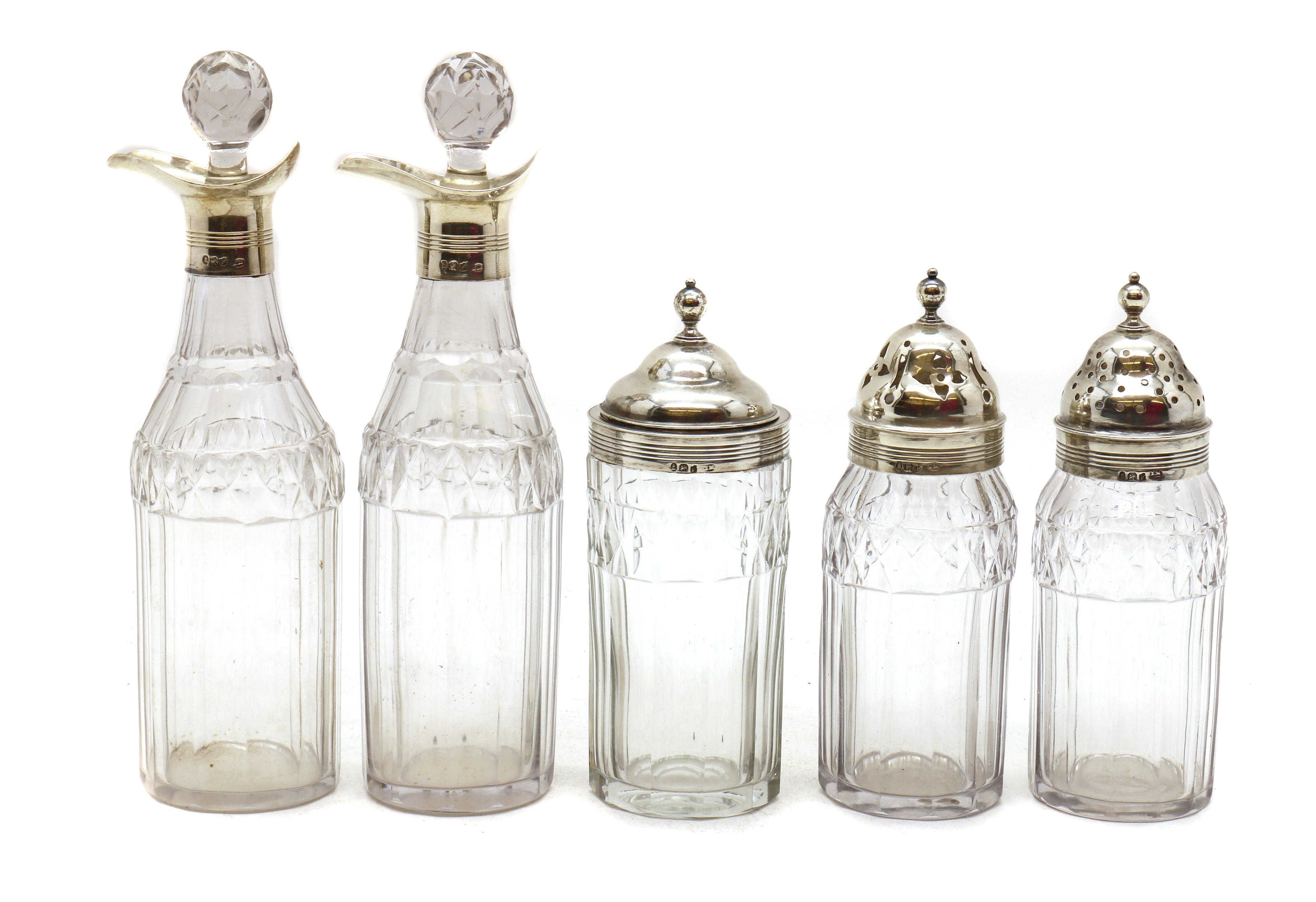 Lot 65 - A set of five silver topped cut glass cruets
