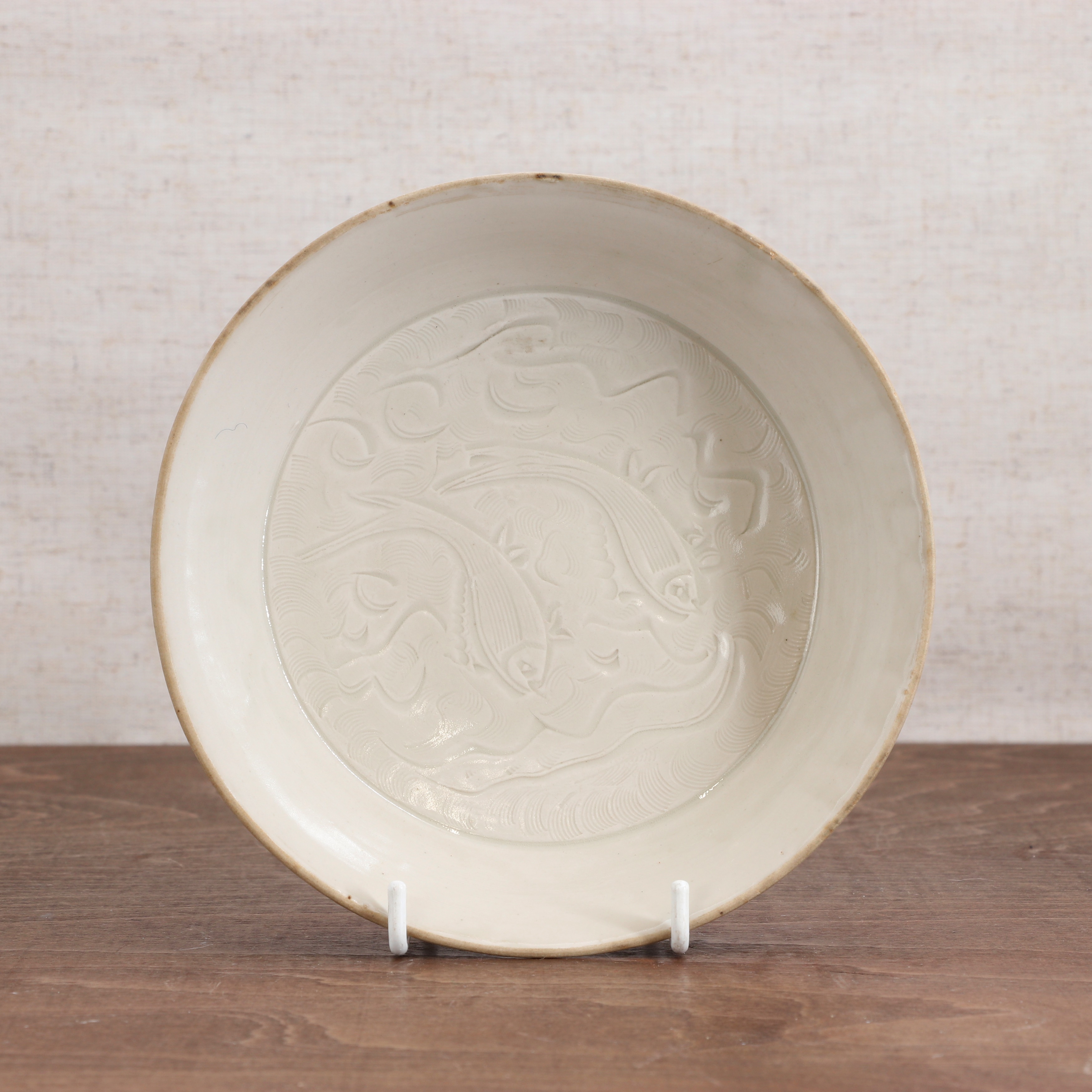 Lot 23 - A Chinese Ding ware dish,