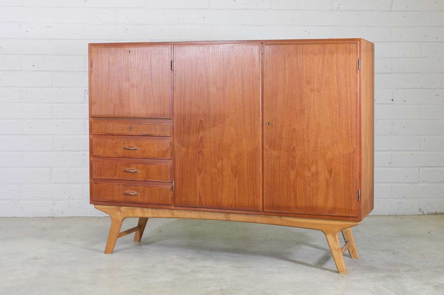 Lot 373 - A Danish teak highboard,