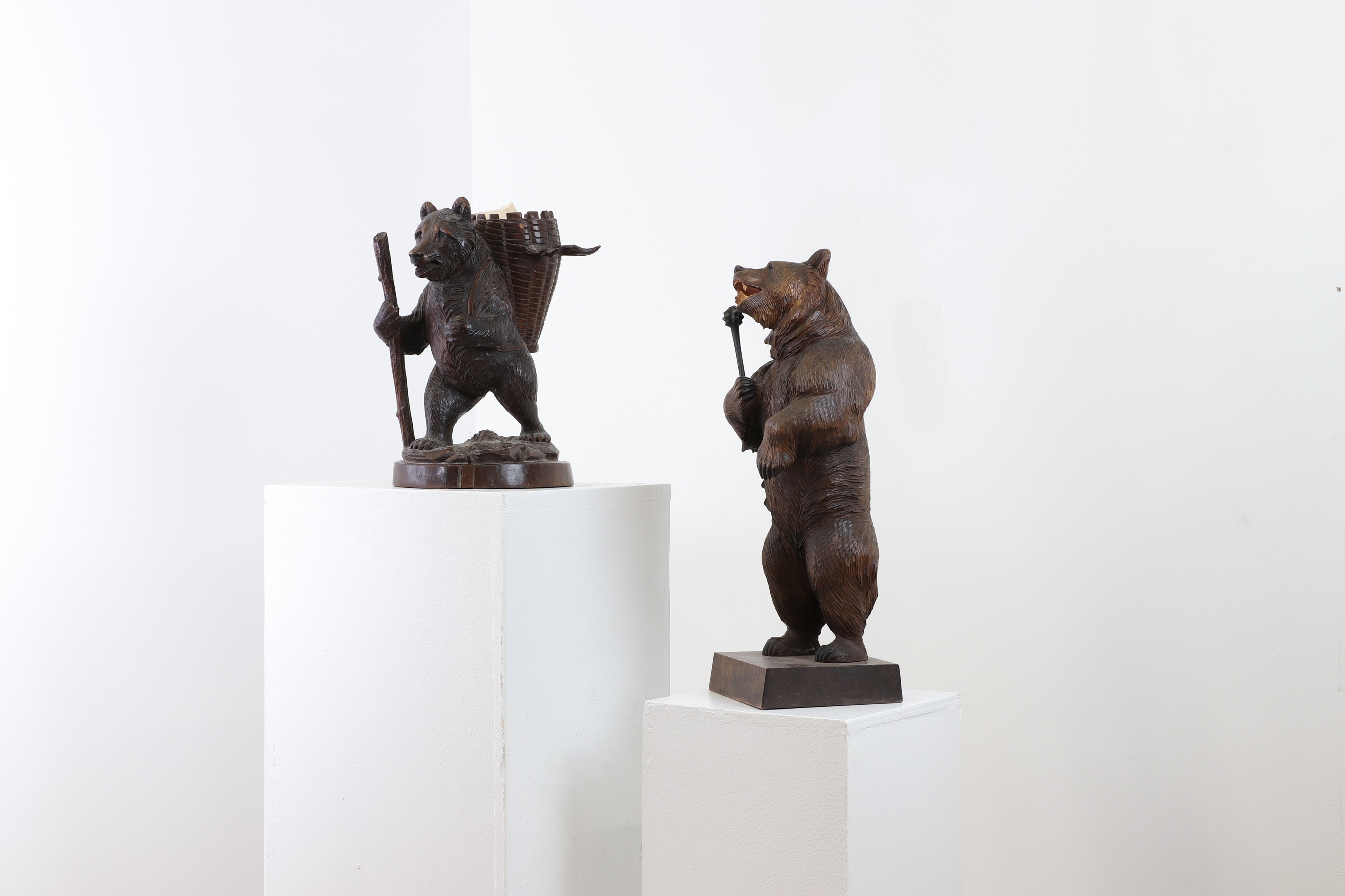 Lot 633 - Two Black Forest carved wood bears,