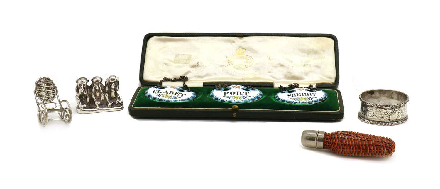 Lot 41 - A set of three enamel spirit labels,