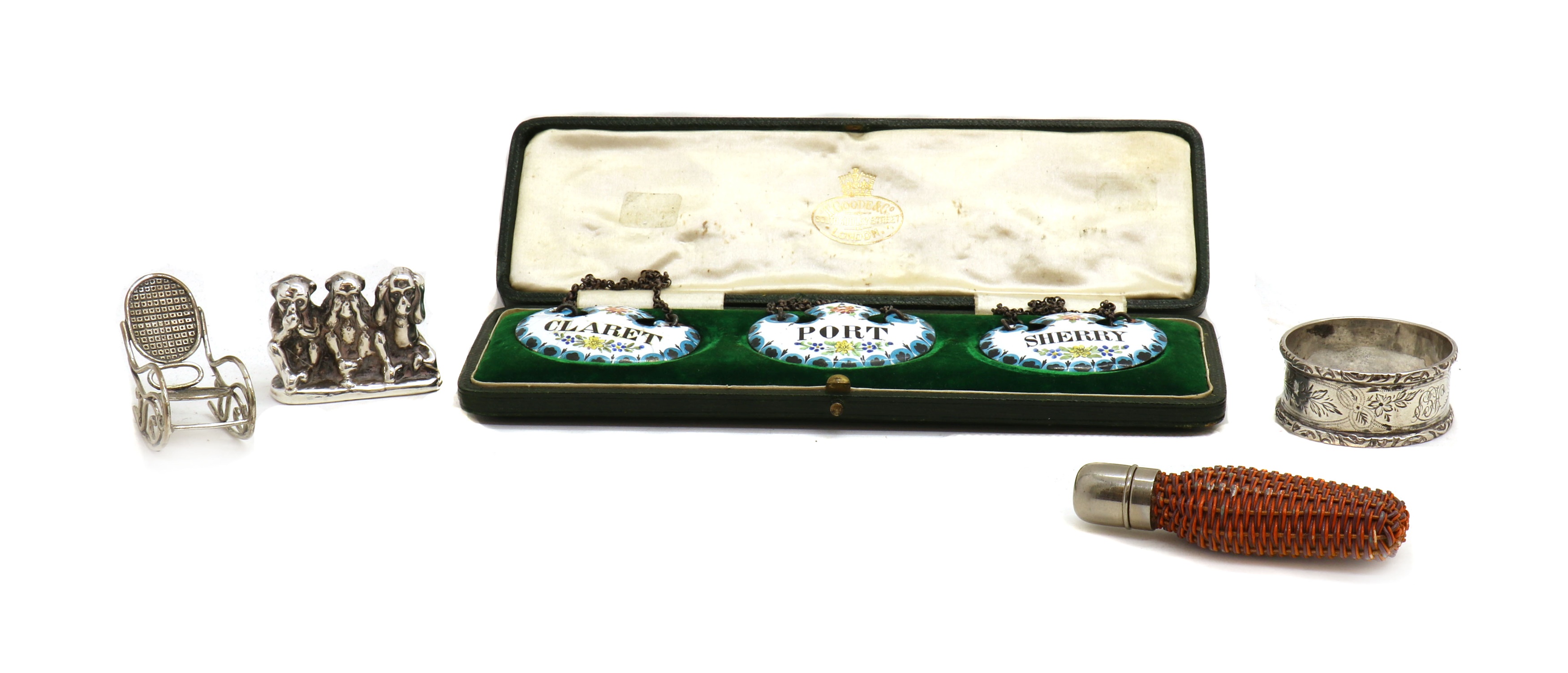 Lot 41 - A set of three enamel spirit labels,