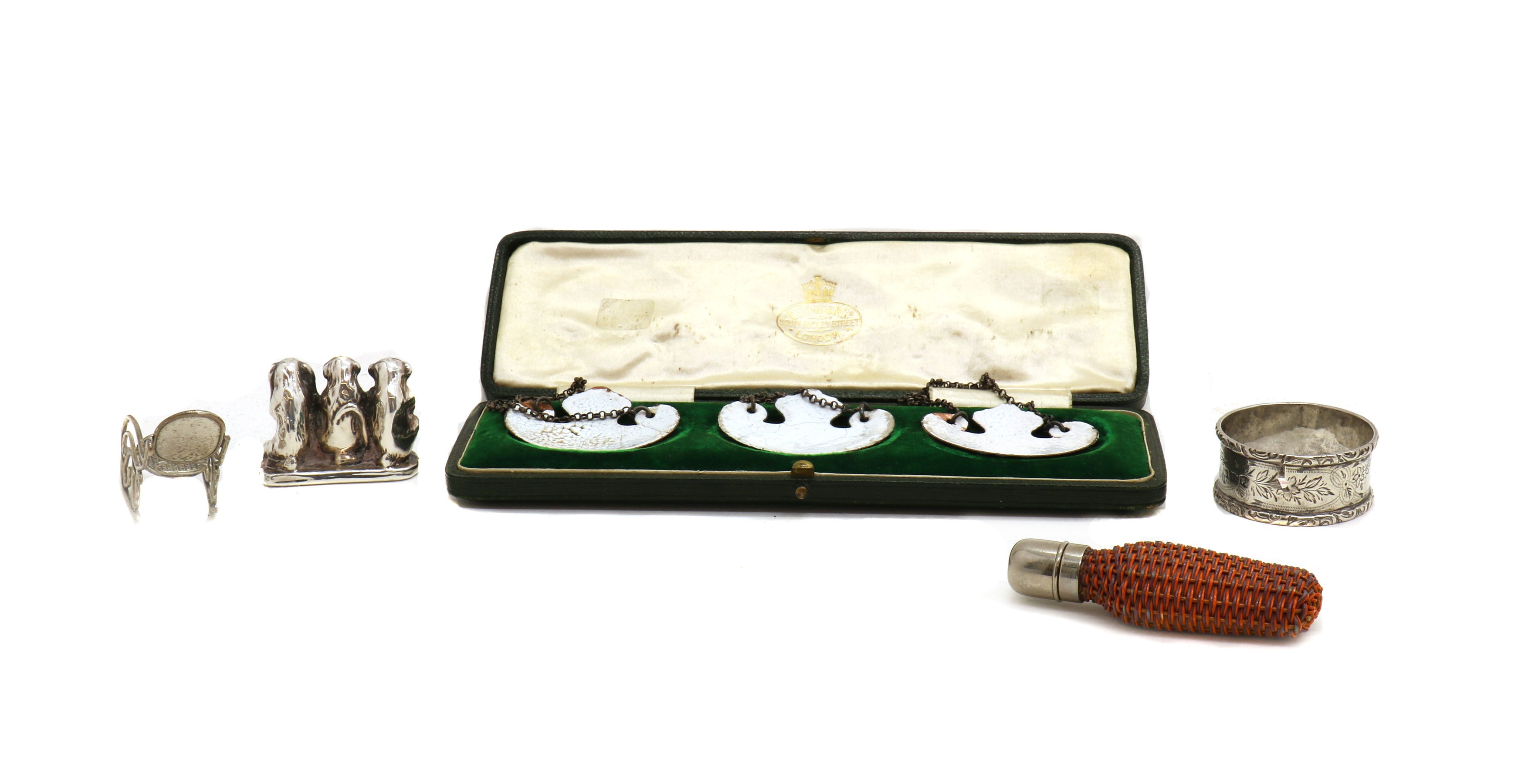 Lot 41 - A set of three enamel spirit labels,