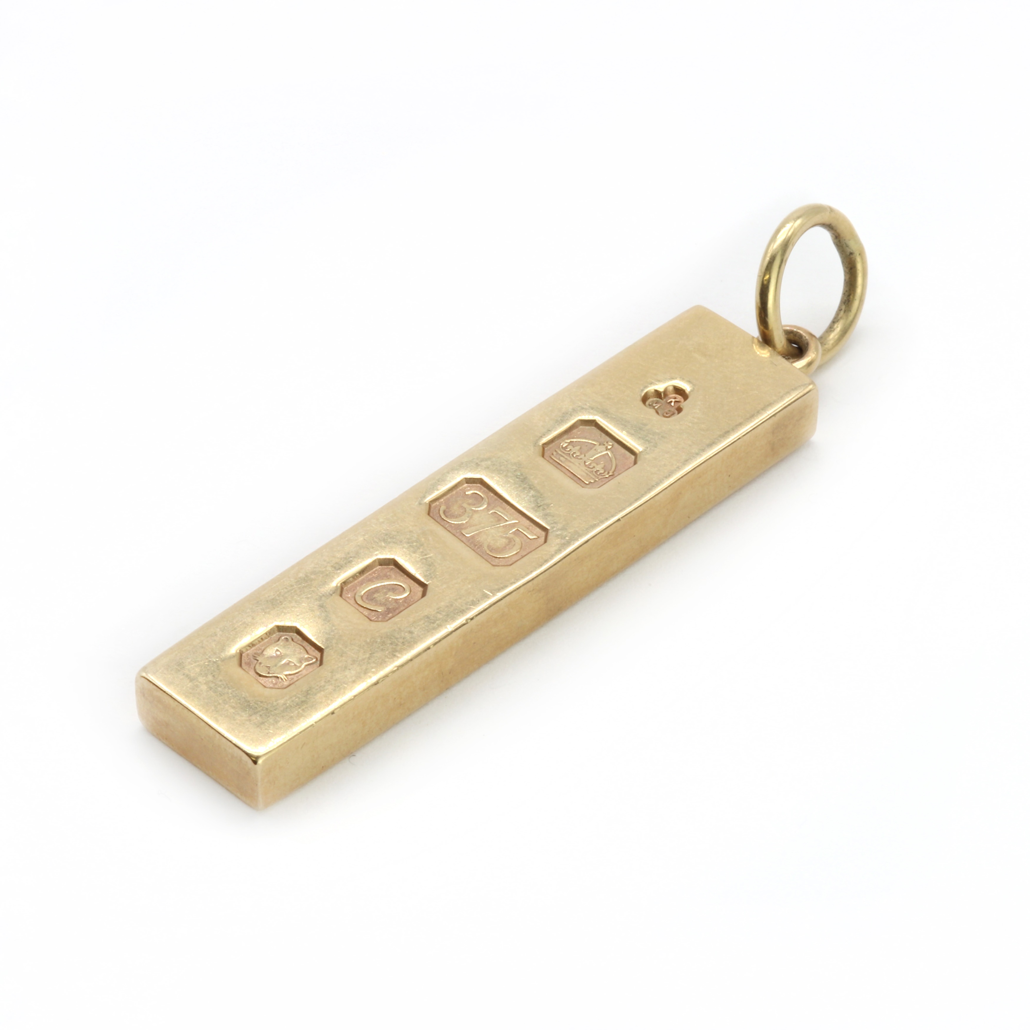 Lot 83 - A 9ct gold ingot pendant,