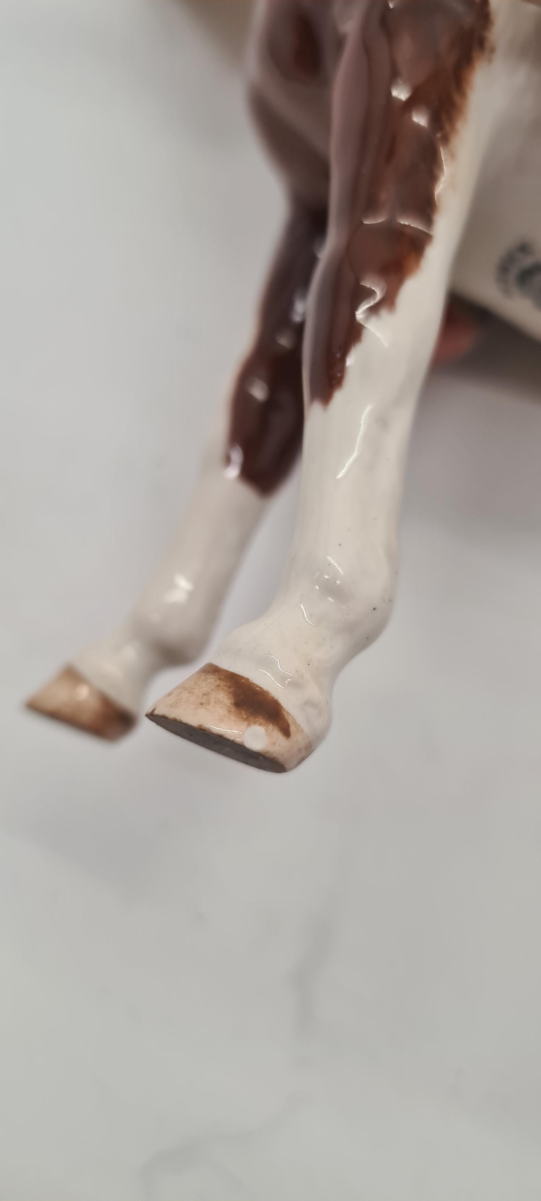 Lot 85 - A group of four Beswick pottery horses,