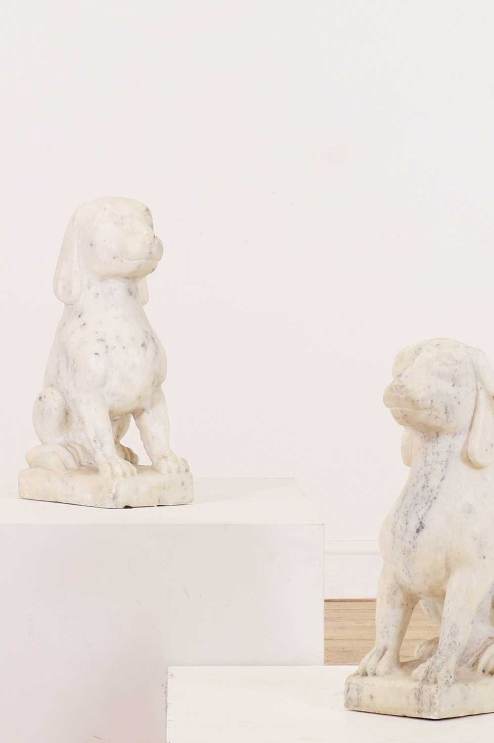 Lot 416 - A pair of Carrara marble dogs,