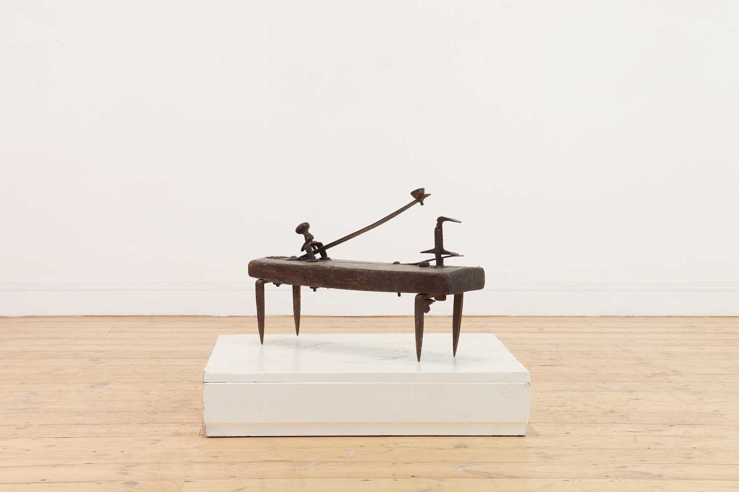 Lot 603 - An oak and iron knurr and spell trap,