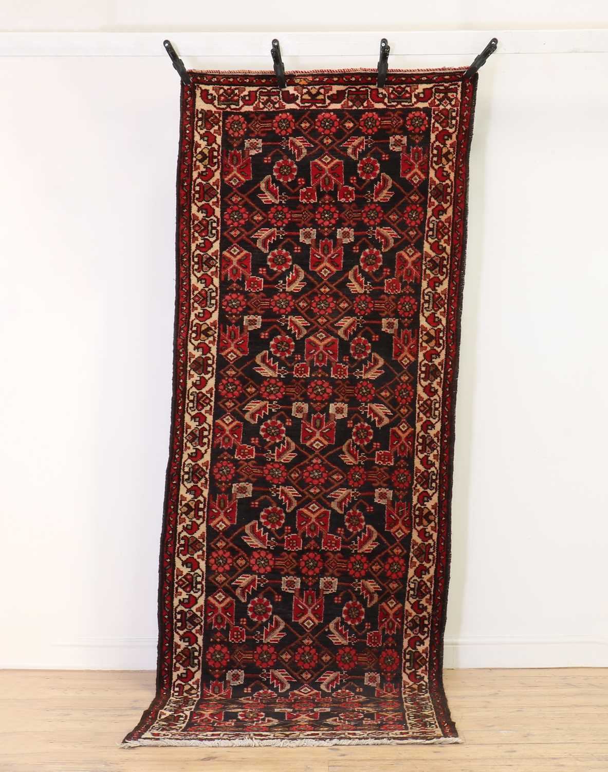 Lot 325 - A Persian wool runner,