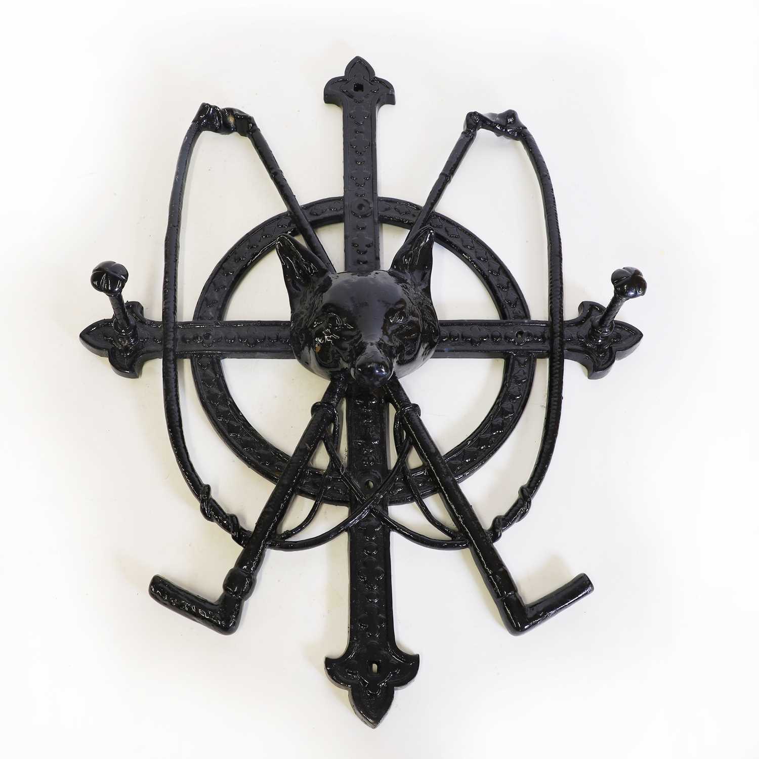 Lot 48 - A cast iron whip rack