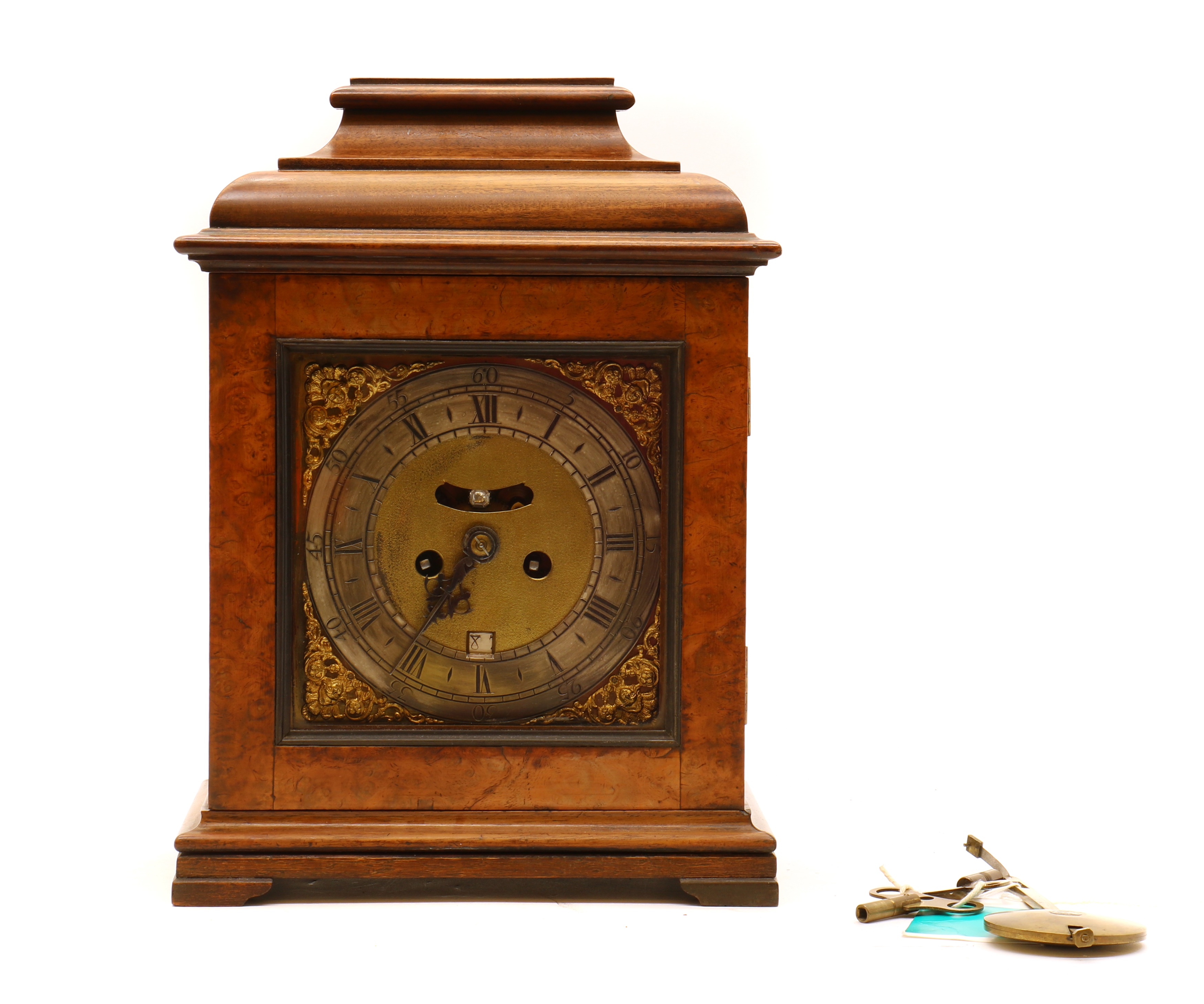 Lot 241 - A mahogany and walnut mantel clock,
