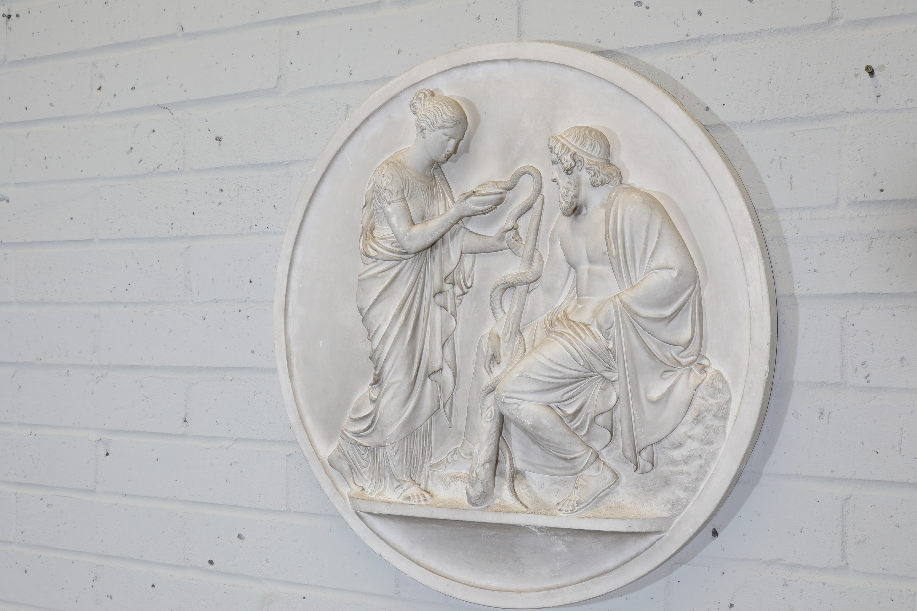 Lot 26 - A modern plaster wall plaque,