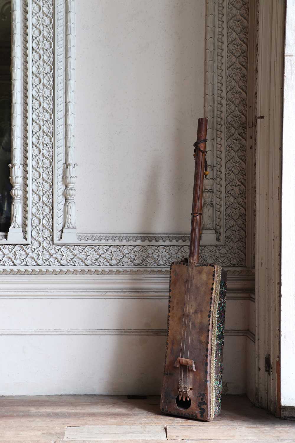 Lot 252 - A three-stringed instrument,