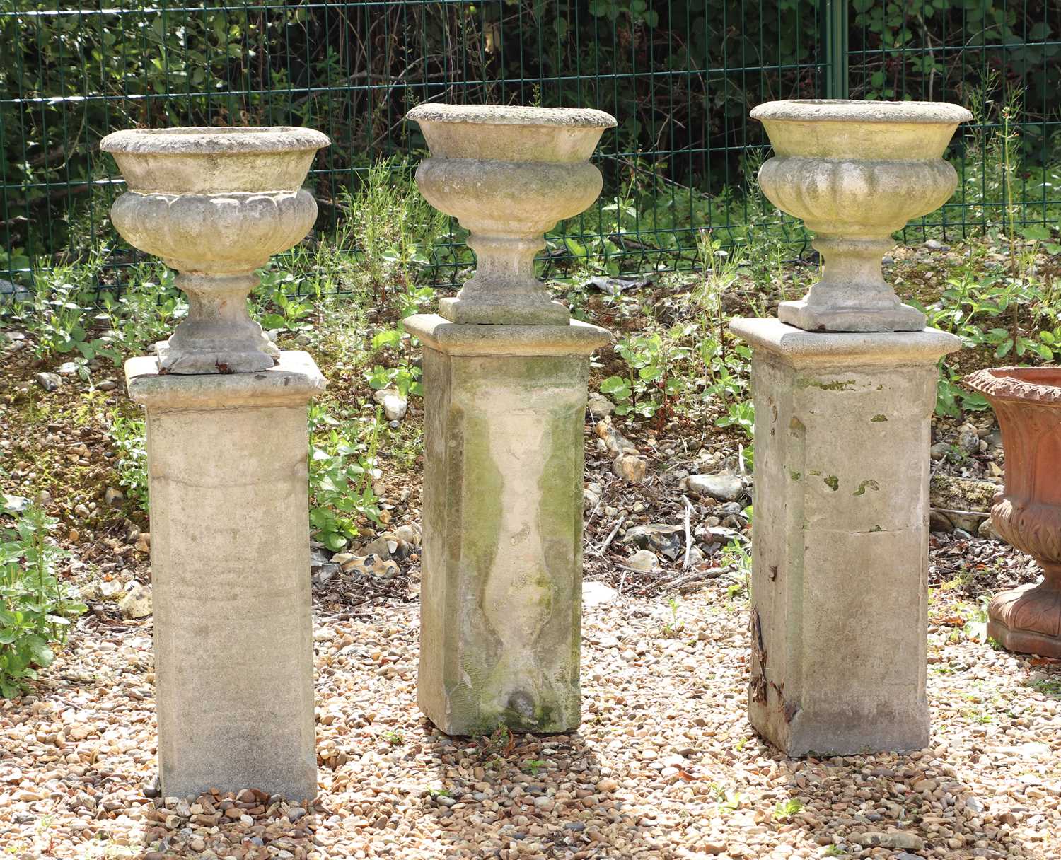 Lot 515 - A group of Classical style urn planters,