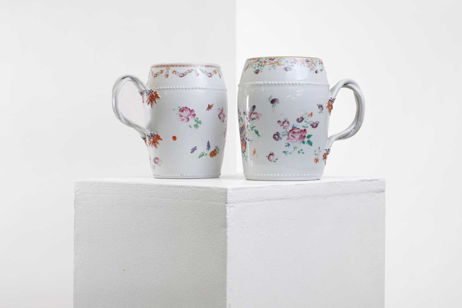 Lot 384 - A pair of export porcelain famille rose mugs,