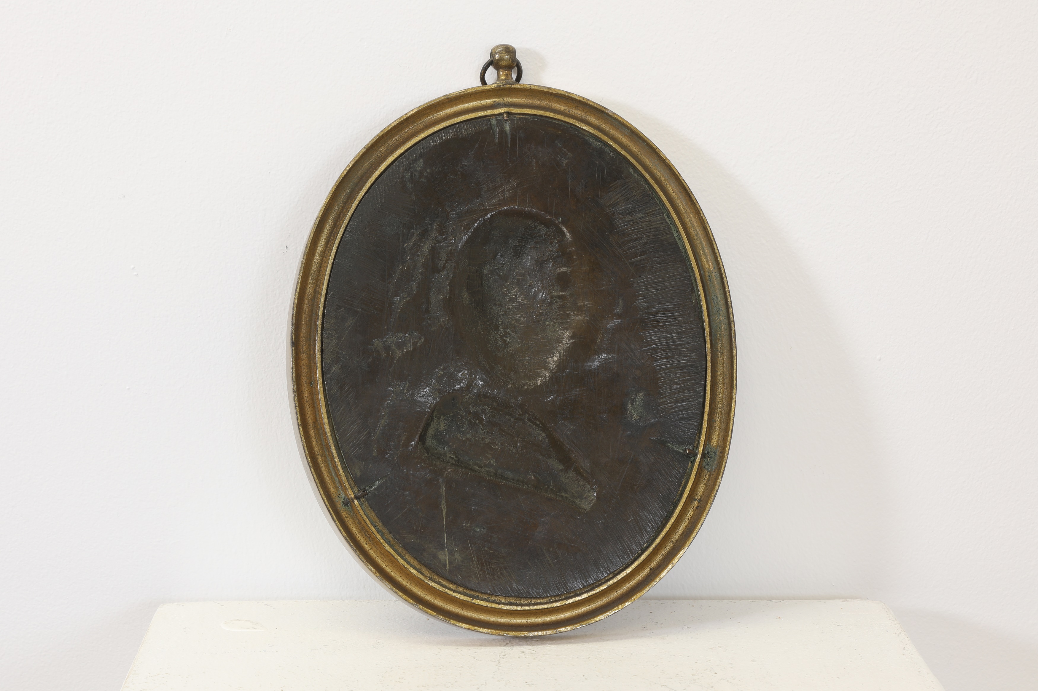 Lot 109 - A bronze oval portrait plaque,