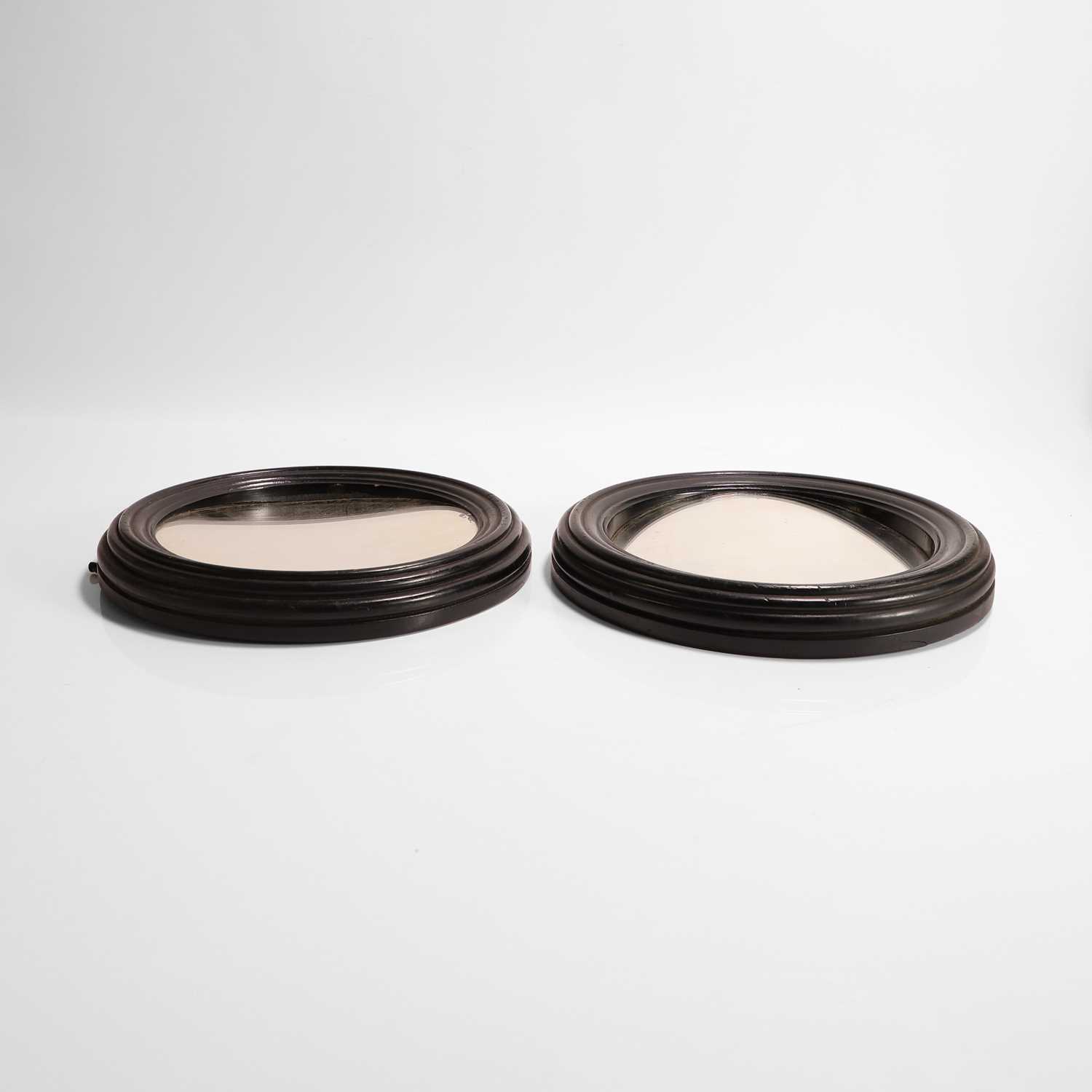 Lot 37 - A rare pair of circular distortion mirrors,