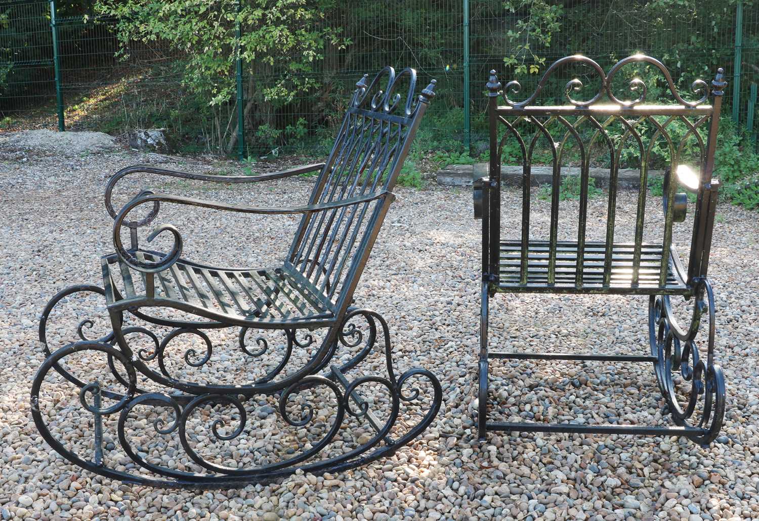 Lot 503 - A pair of wrought iron garden rocking chairs
