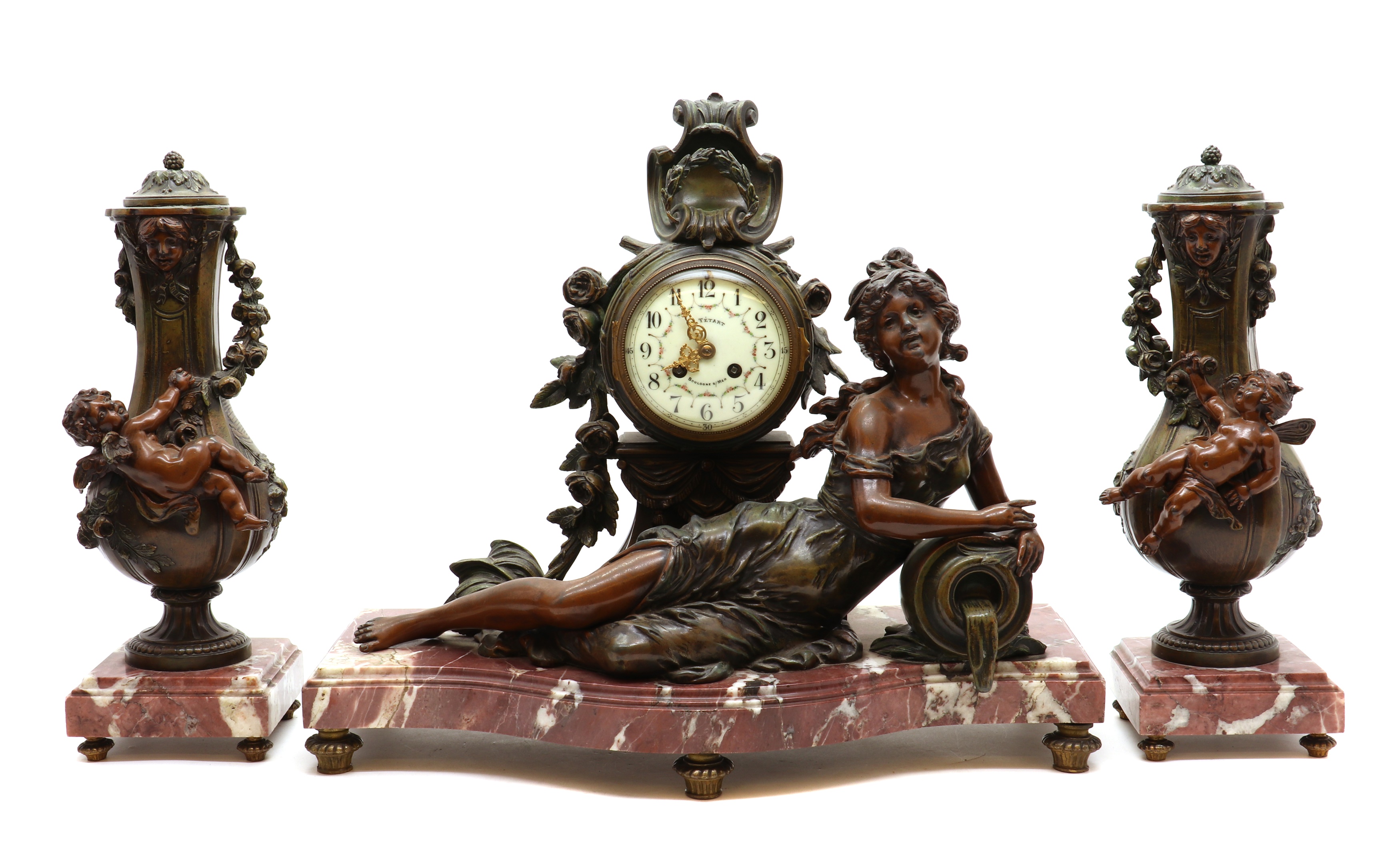 Lot 292 - A spelter clock garniture