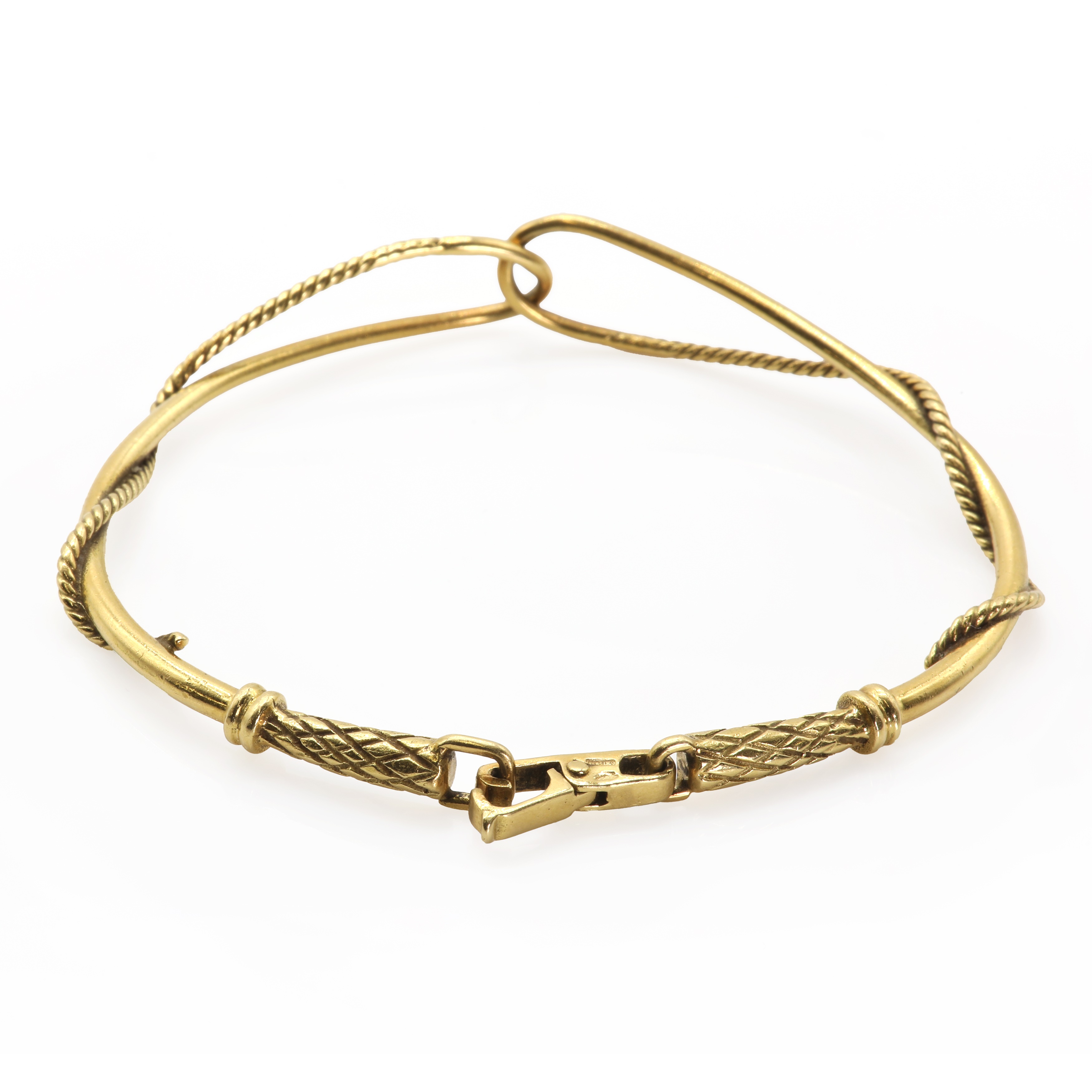 Lot 62 - An 18ct gold rope design articulated bangle,
