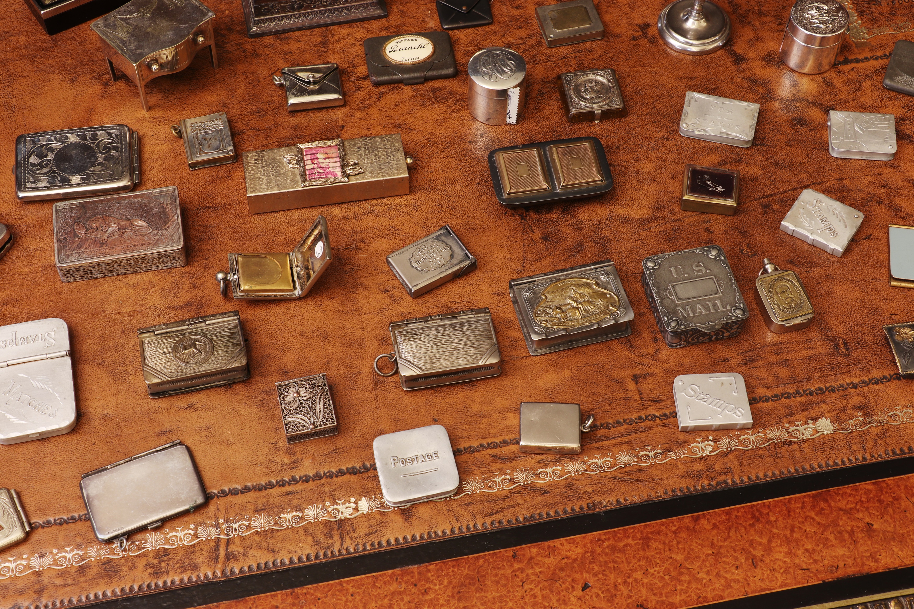 Lot 94 - A collection of silver-plated stamp boxes,
