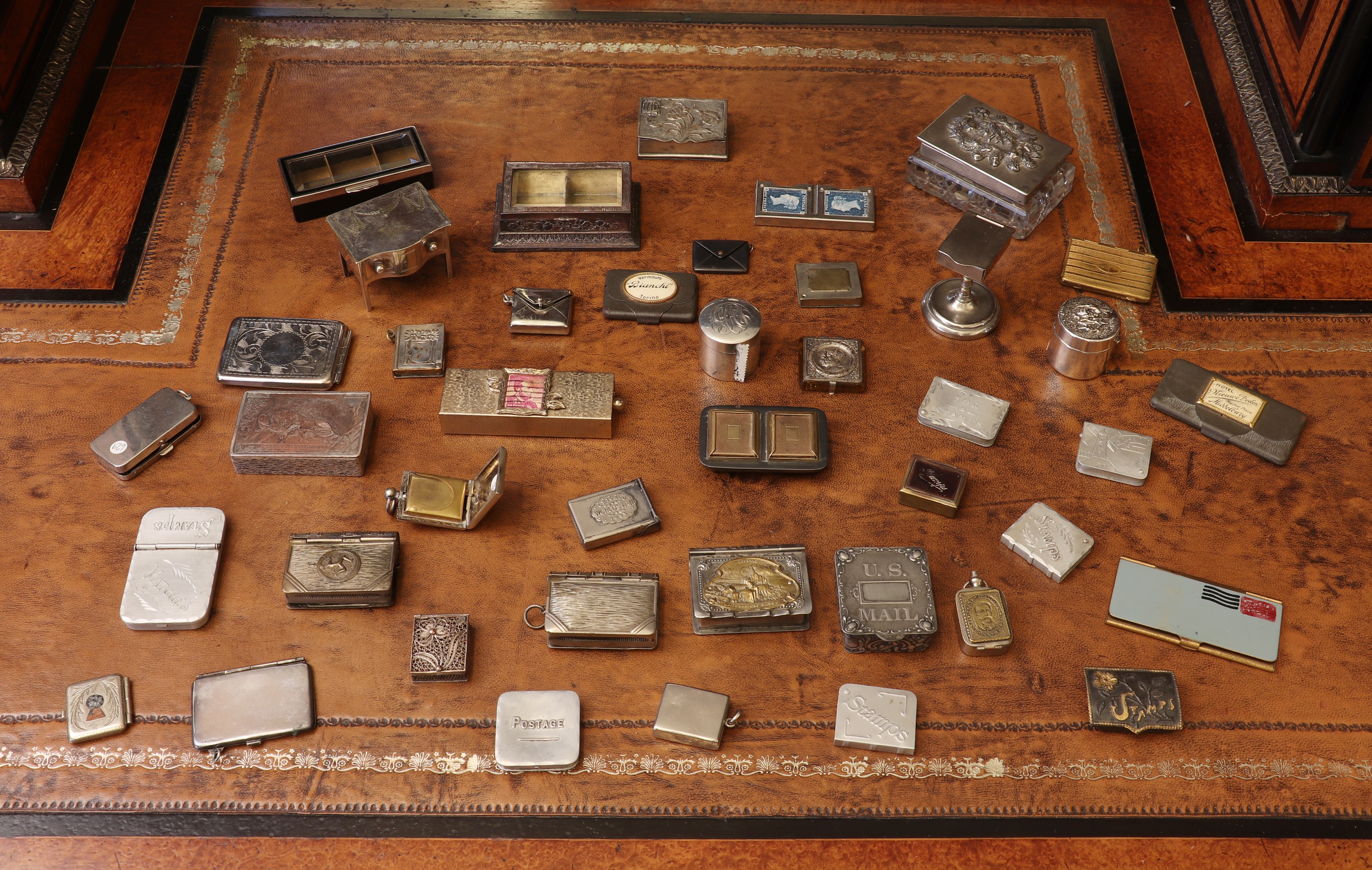 Lot 94 - A collection of silver-plated stamp boxes,