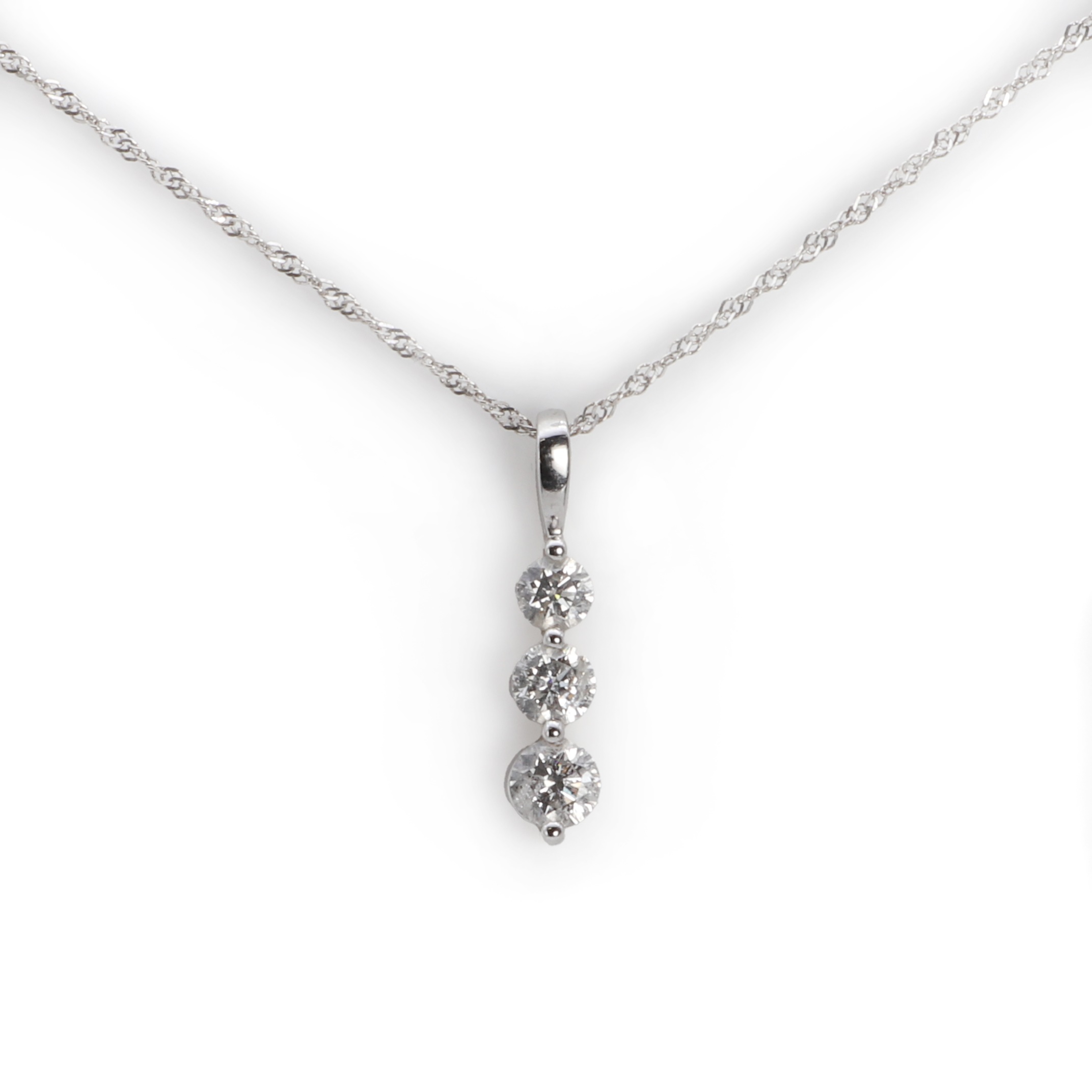 Lot 1060 - A three stone diamond pendant with chain,