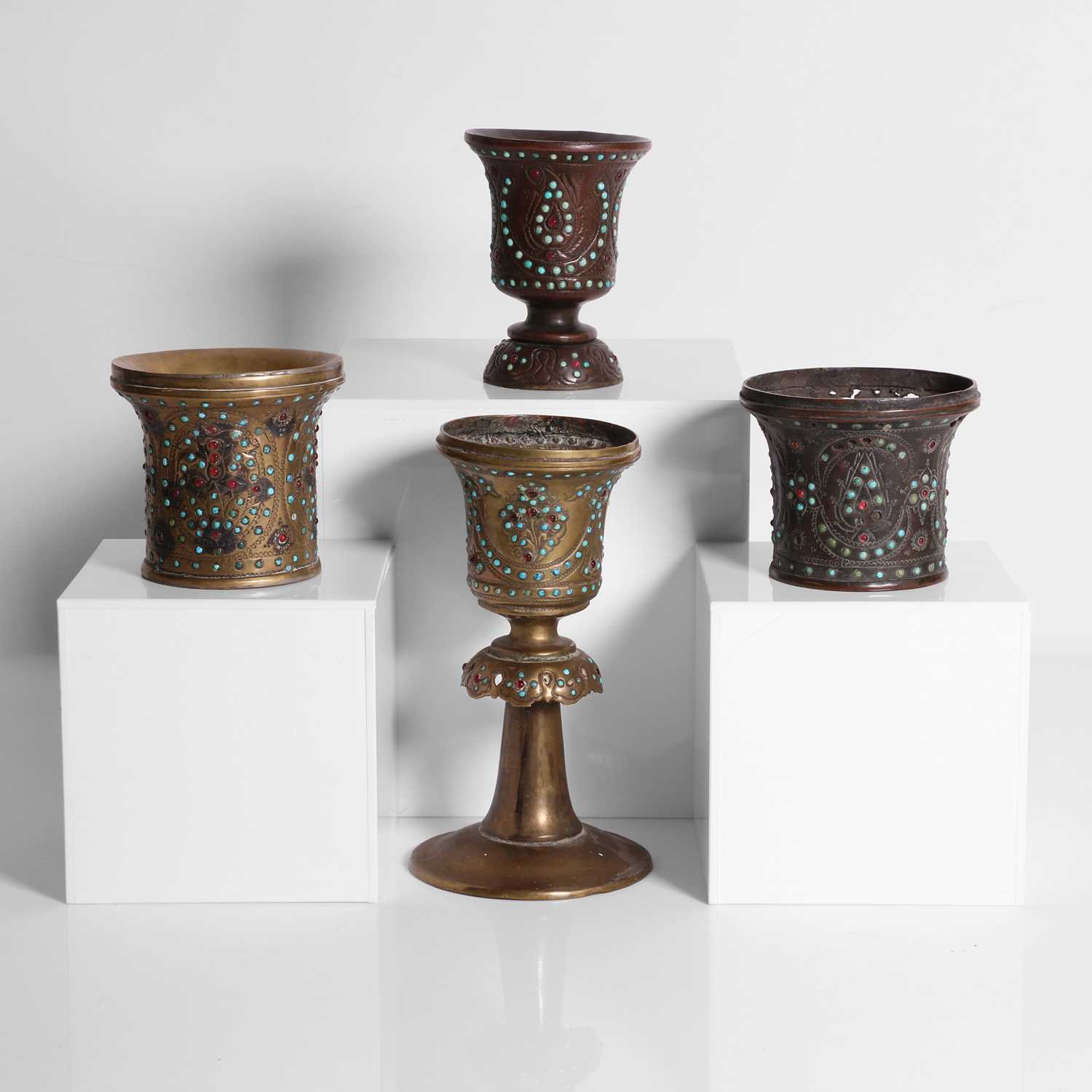 Lot 152 - A group of four hookah pipe cups,