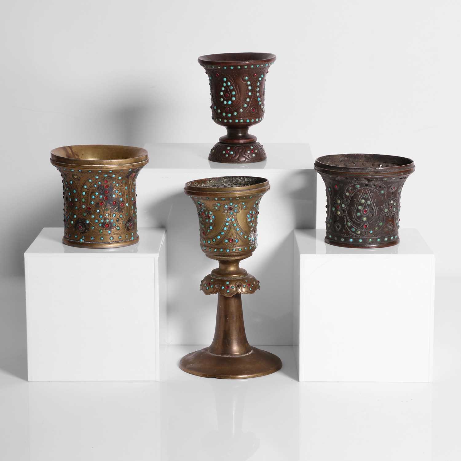 Lot 152 - A group of four hookah pipe cups,
