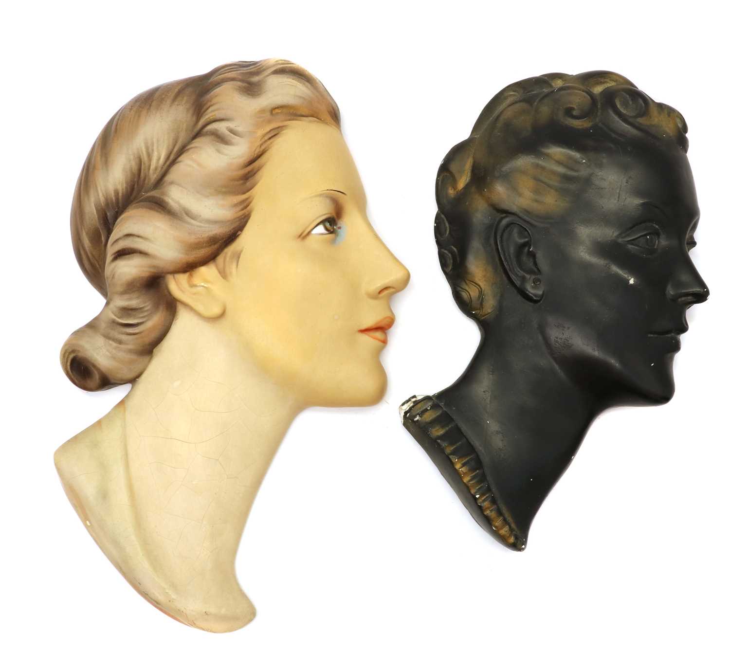 Lot 70 - Two Art Deco painted plaster wall masks,
