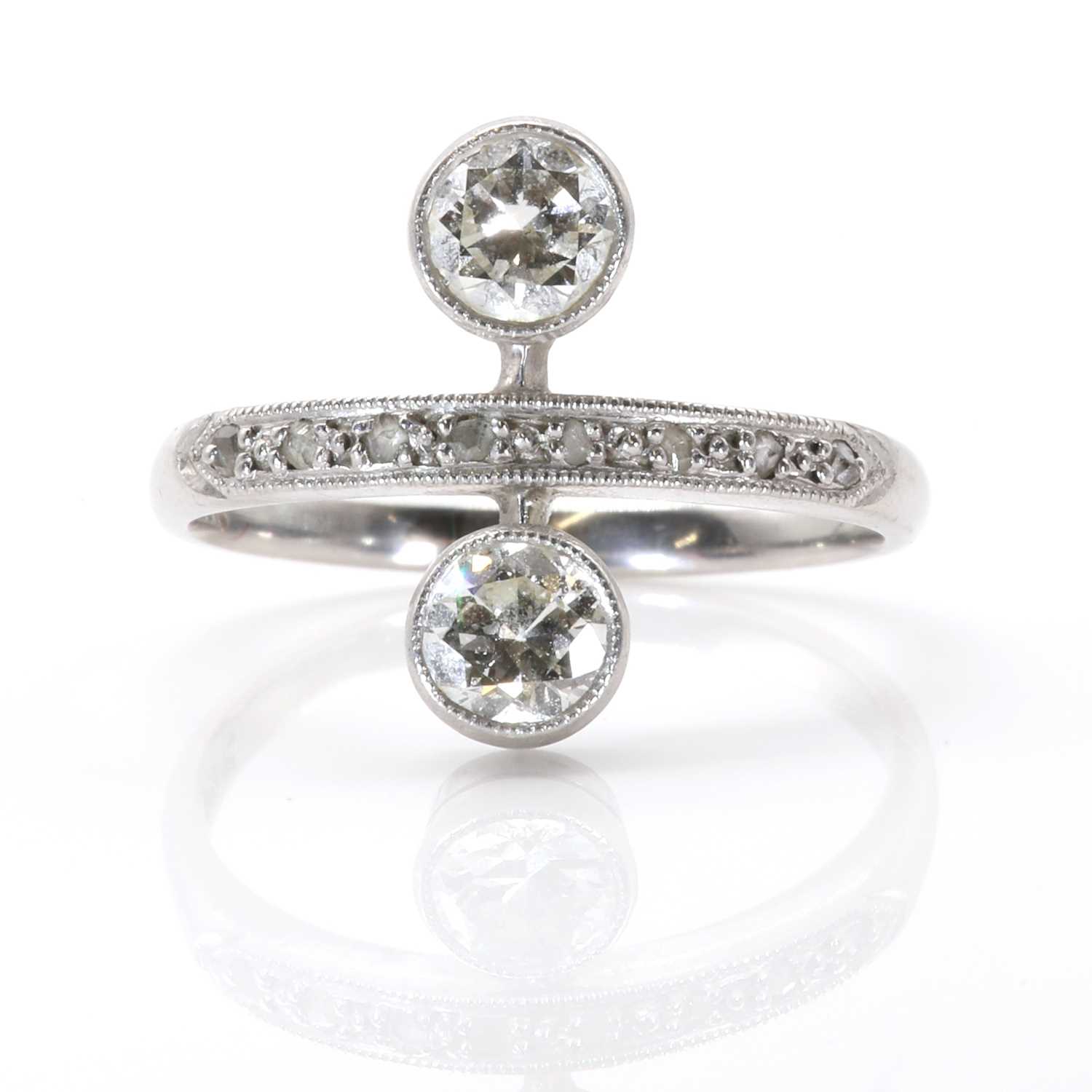 Lot 45 - A vertical two stone diamond ring,