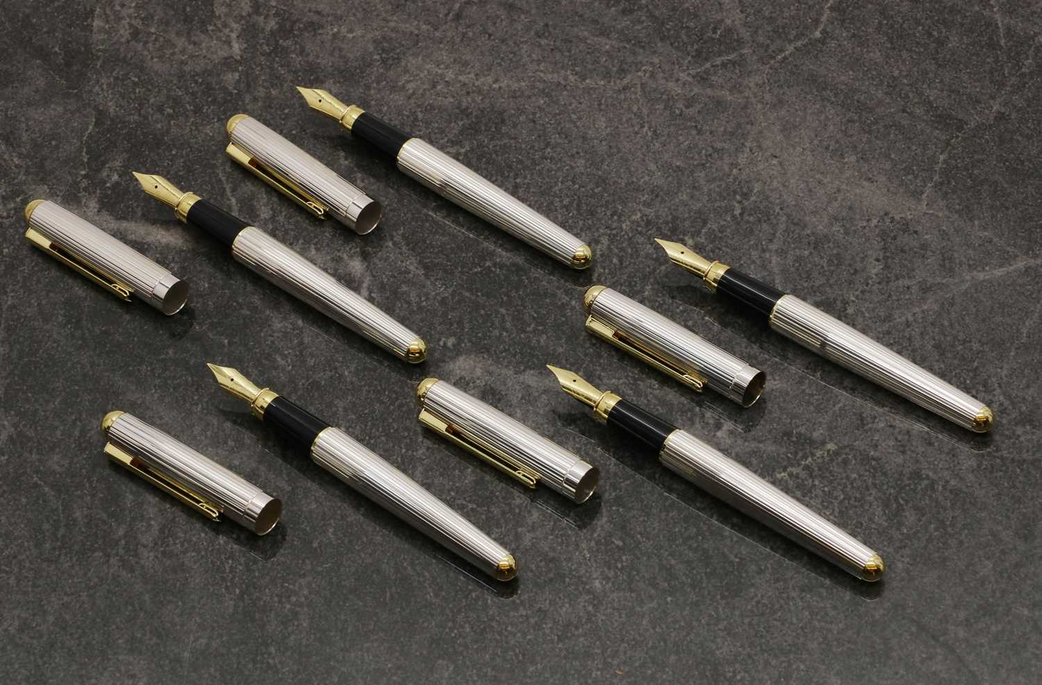 Lot 39 - A group of five silver fountain pens