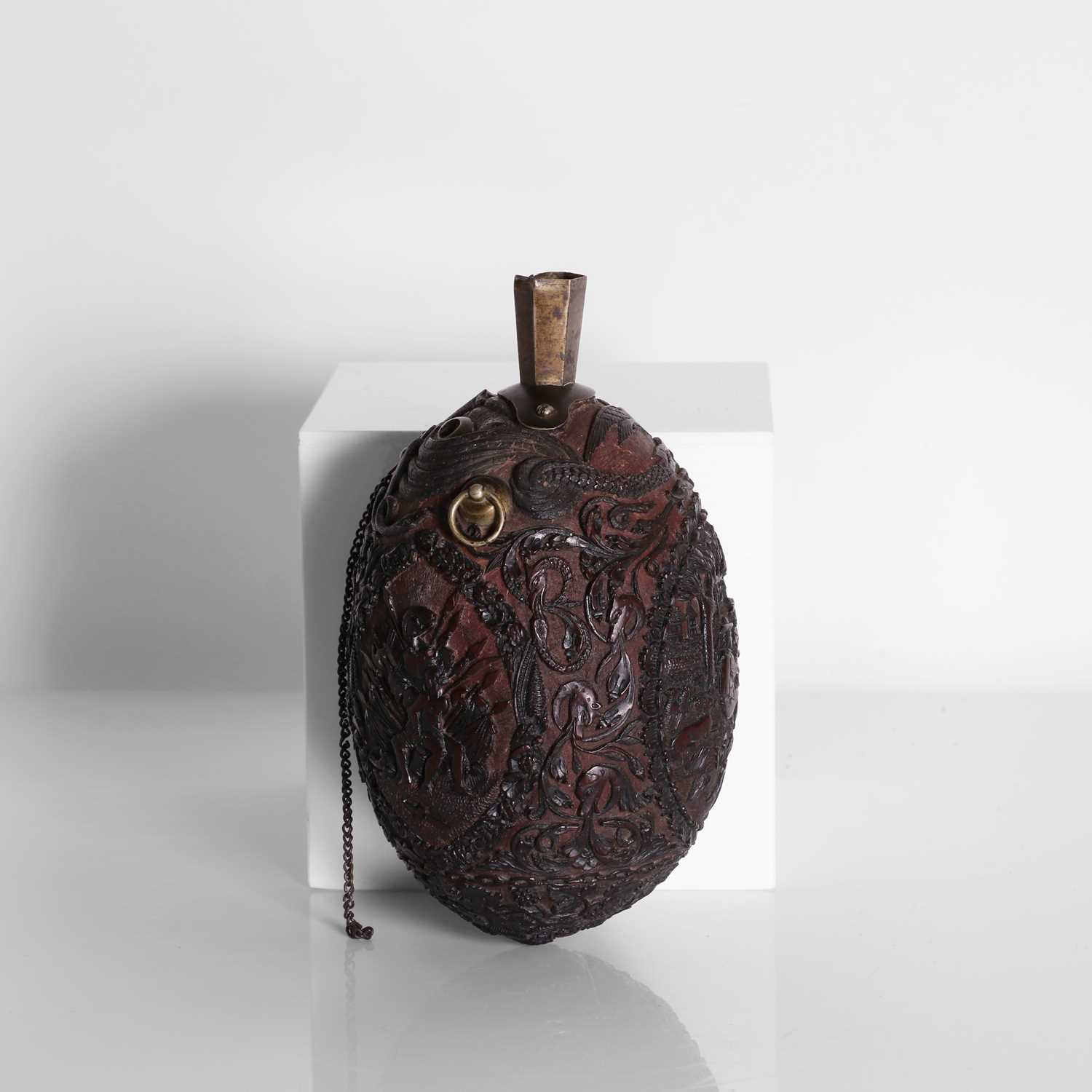 Lot 2 - A carved coconut 'bugbear' flask,