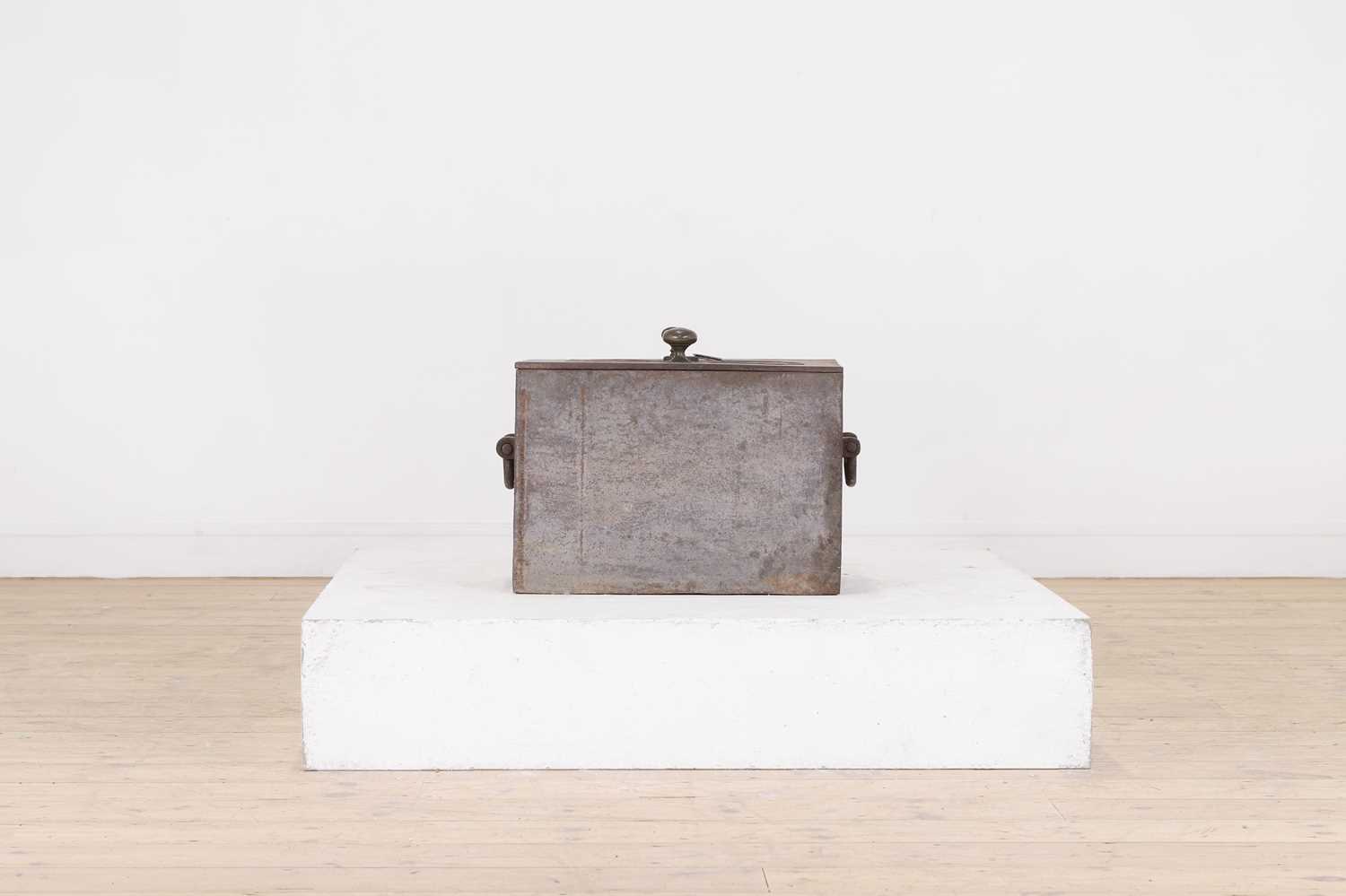 Lot 410 - An iron box safe,