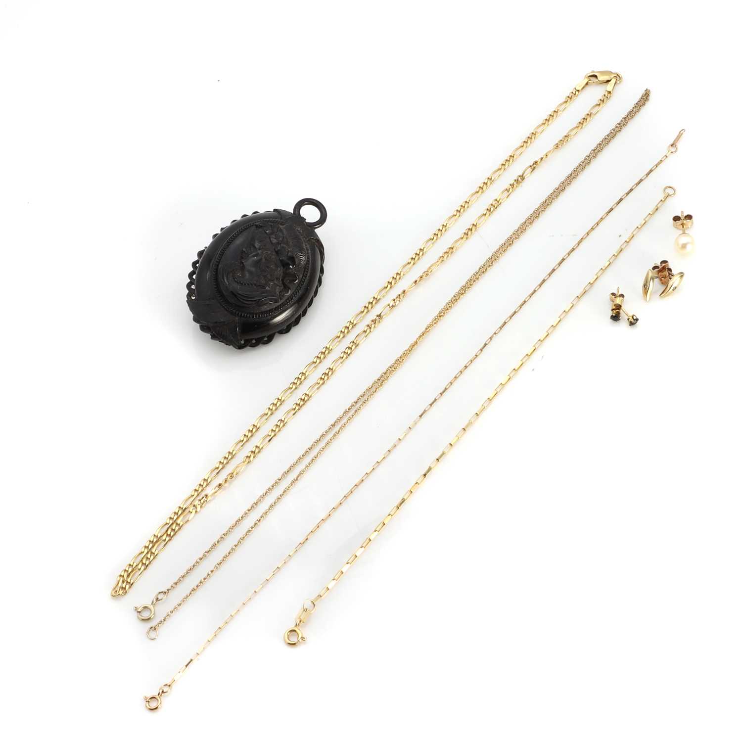 Lot 1333 - A carved jet pendant and a small collection