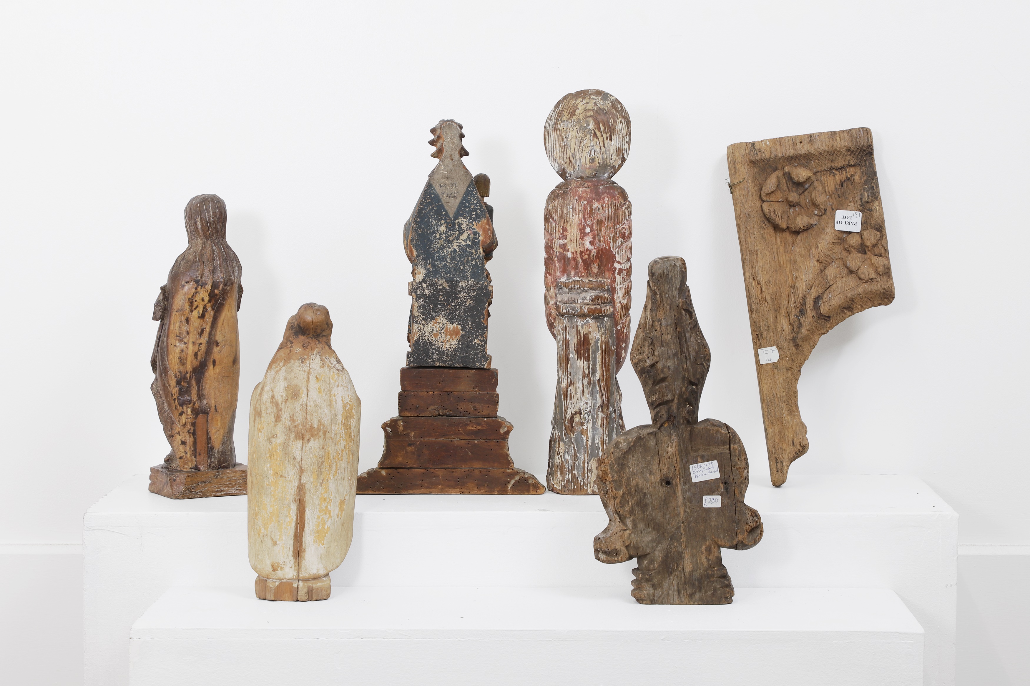 Lot 93 - A group of carved wood saints and