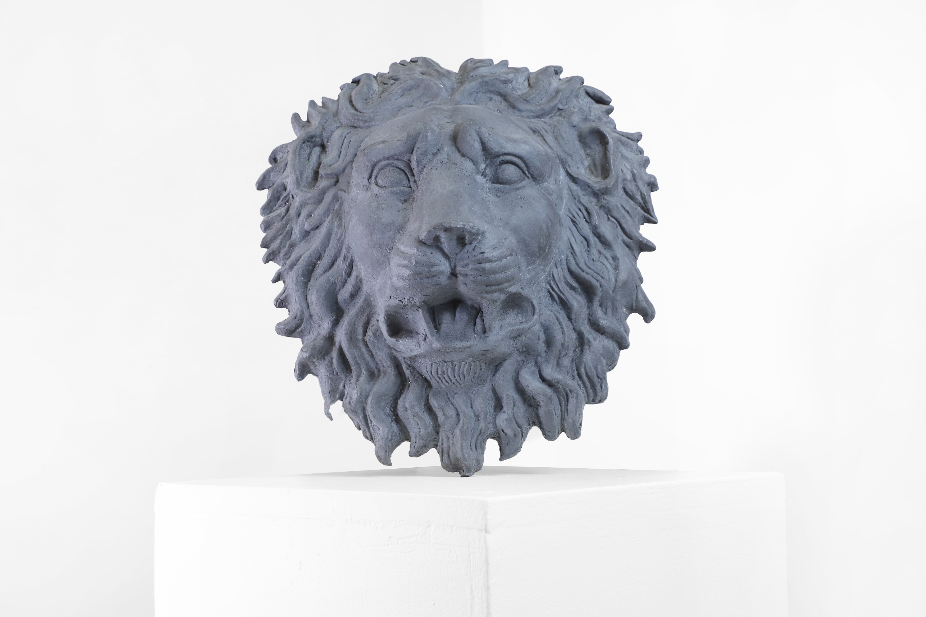 Lot 416 - A cast lead lion wall mask,
