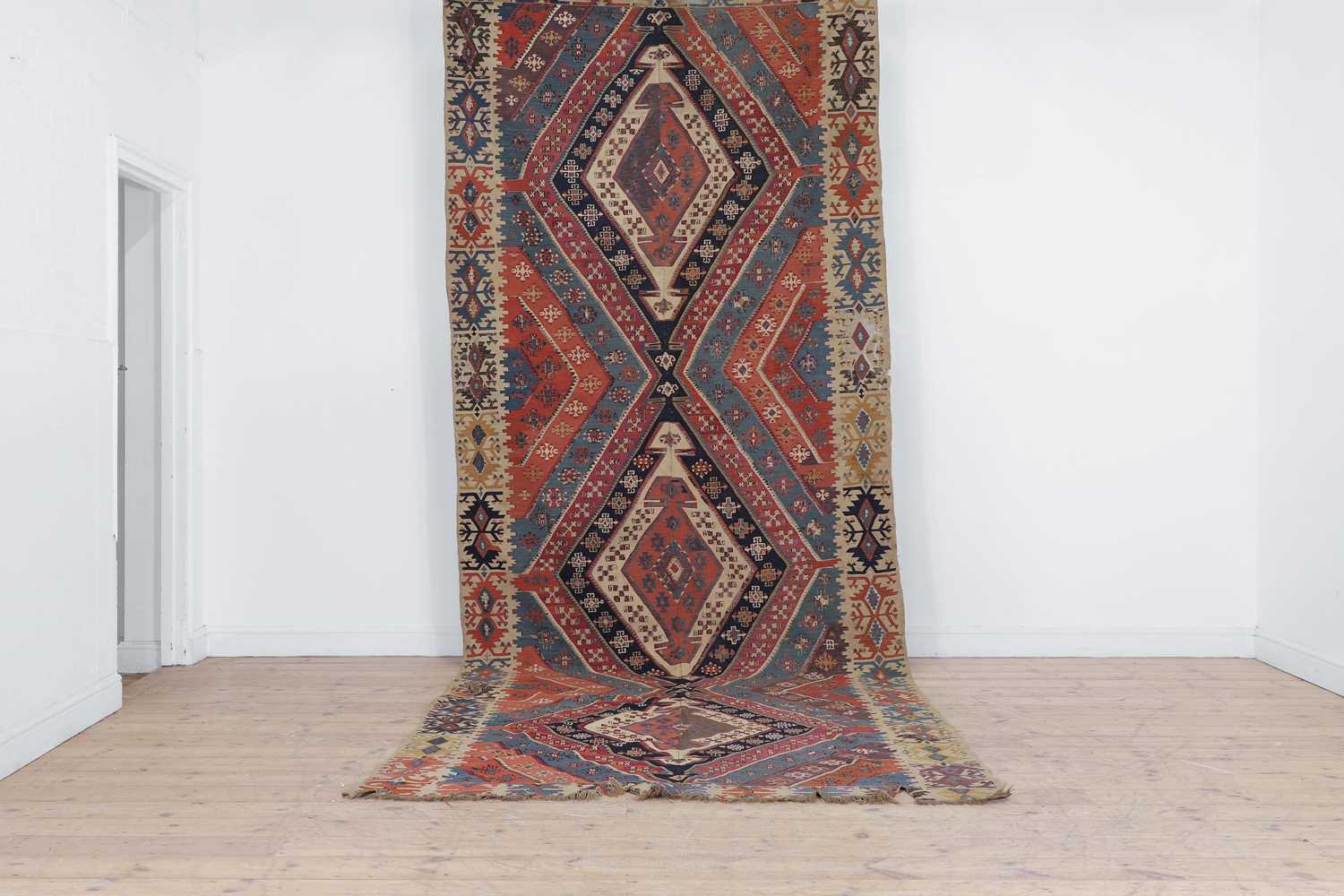 Lot 411 - An Anatolian kilim flat-weave runner,