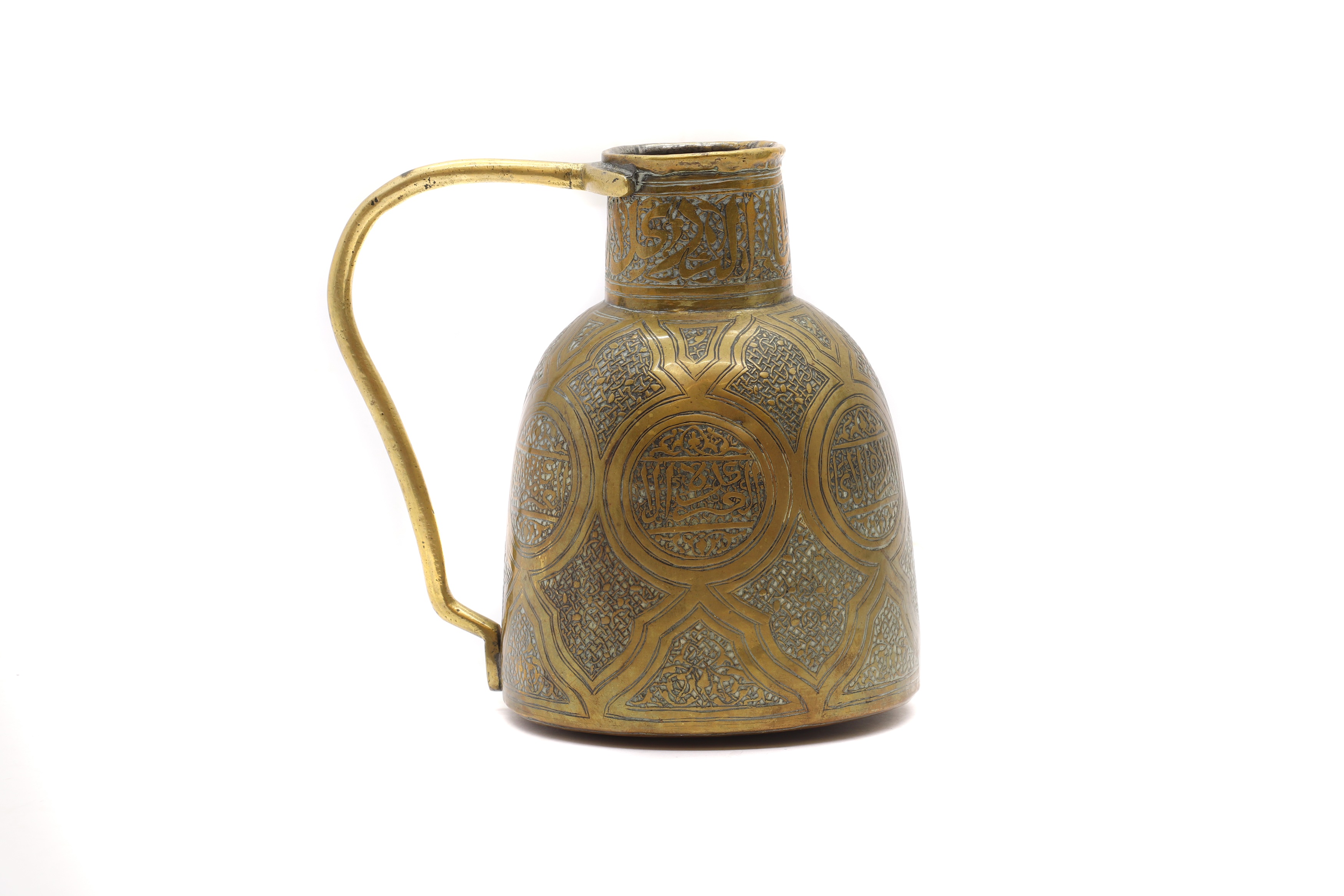 Lot 56 - An Islamic brass jug