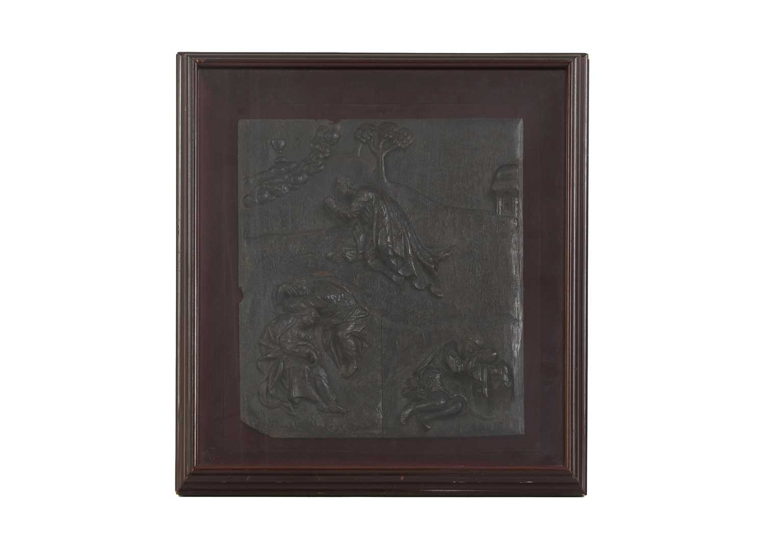 Lot 392 - A large carved oak and painted bas-relief
