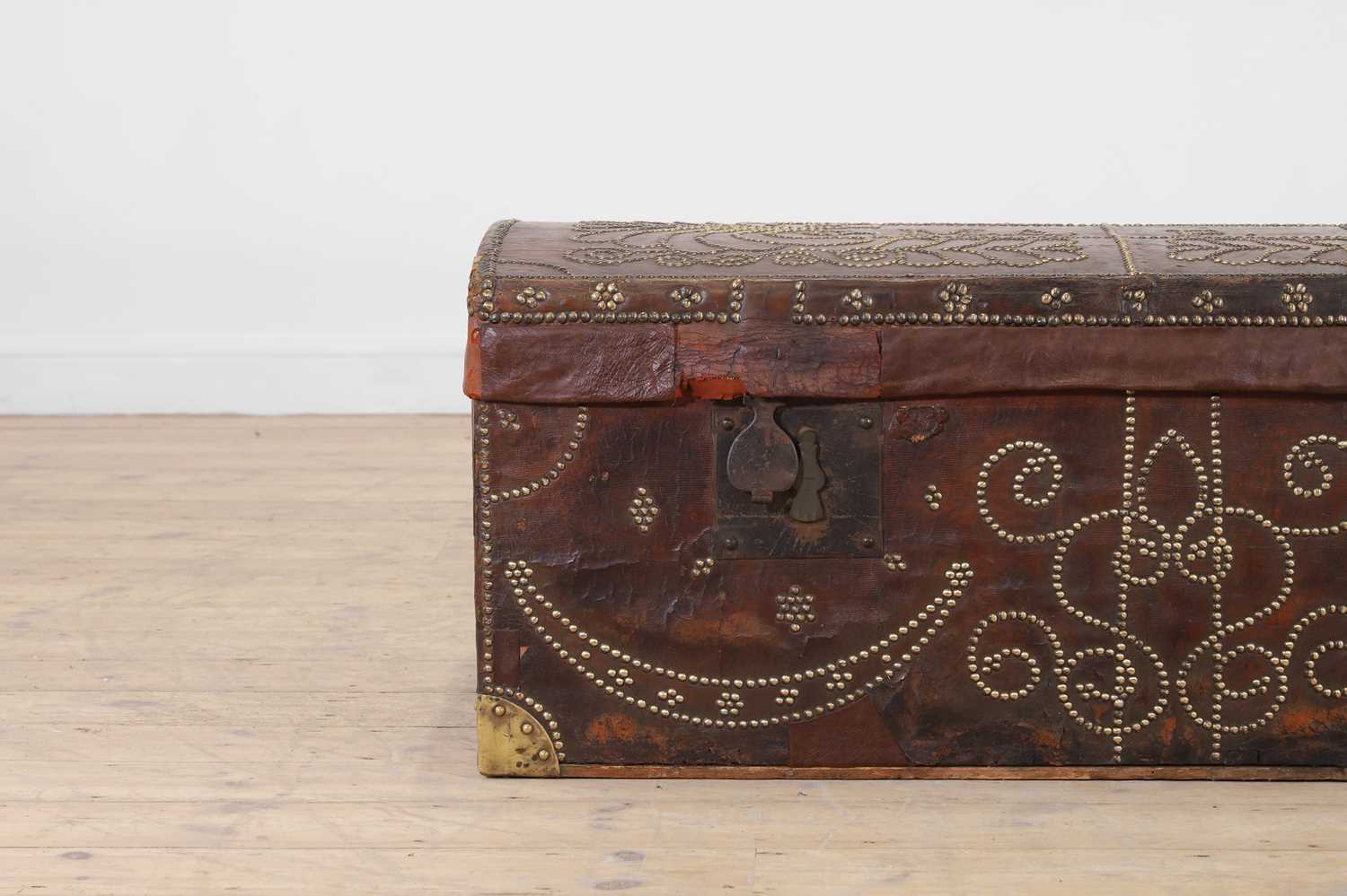 Lot 449 - A studded leather trunk,