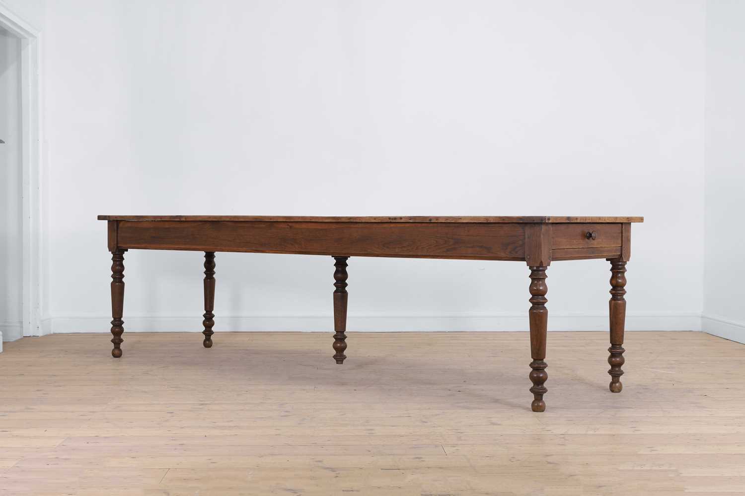 Lot 64 - A Victorian oak kitchen table,
