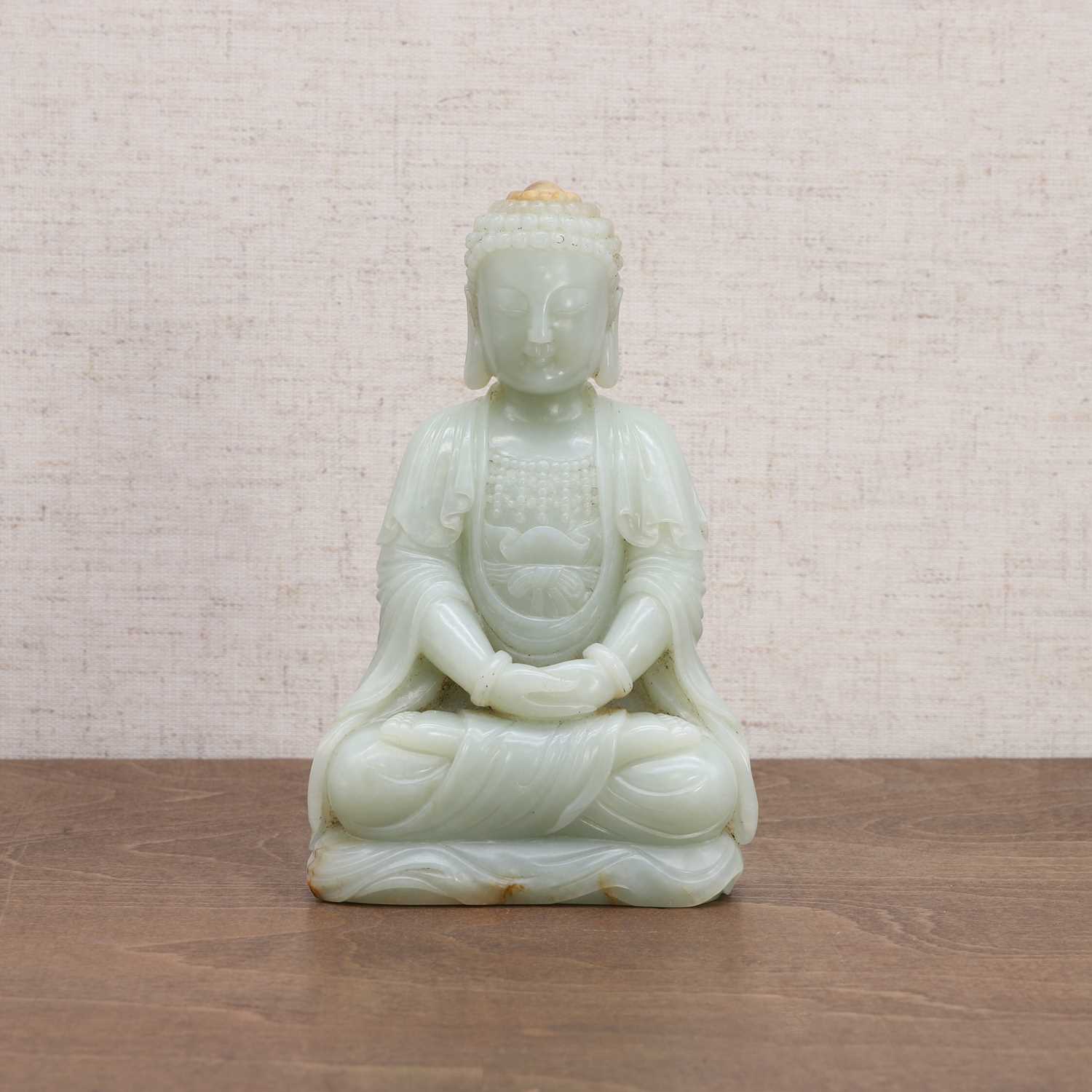 Lot 256 - A Chinese jade Buddha,