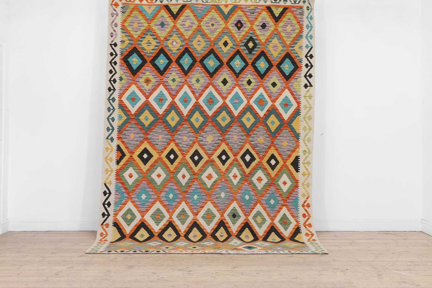 Lot 12 - A kilim flat-weave rug,