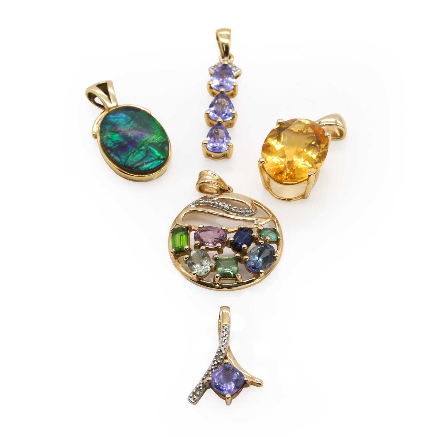 Lot 263 - A group of five gold gem set pendants,