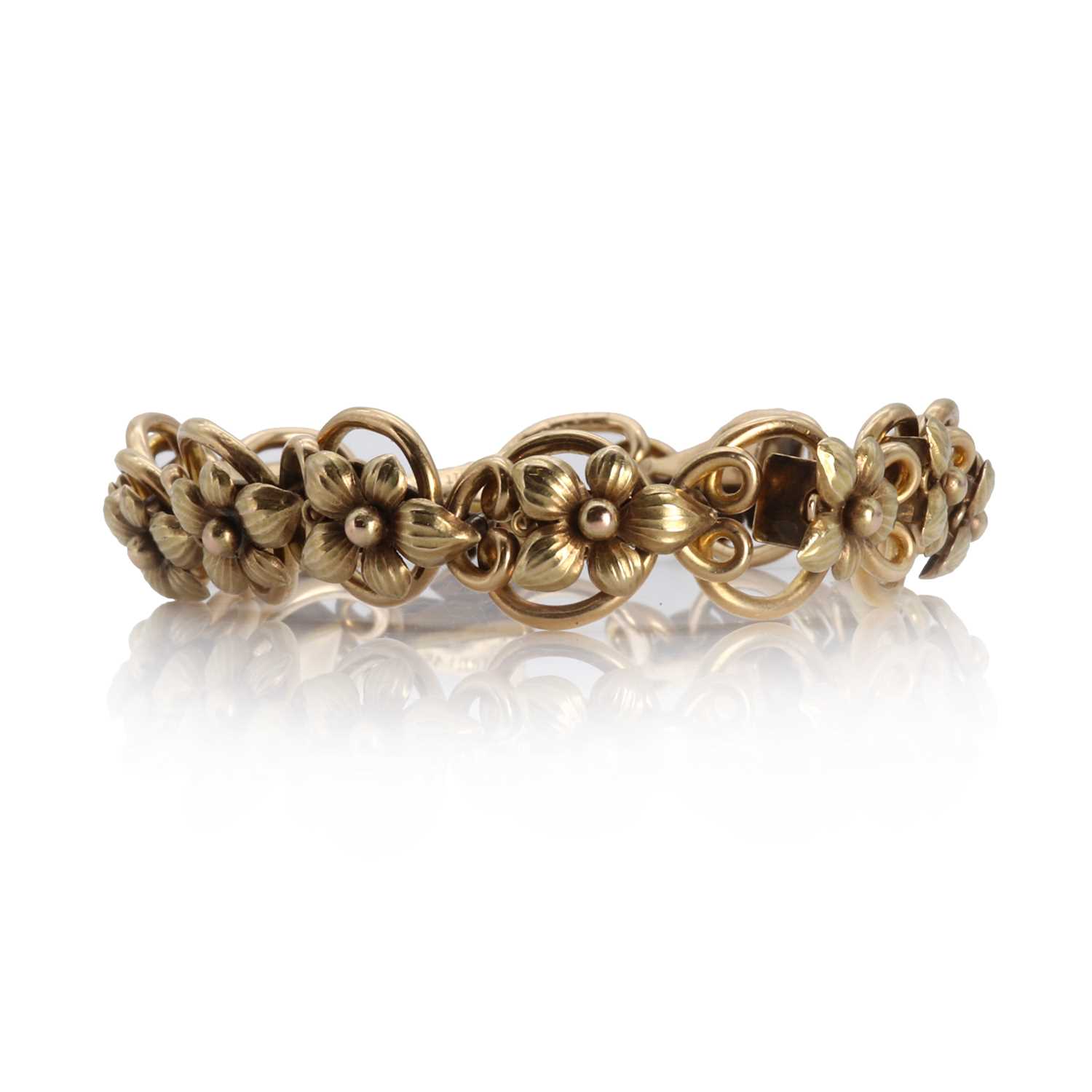 Lot 338 - A gold floral panel expanding bracelet,