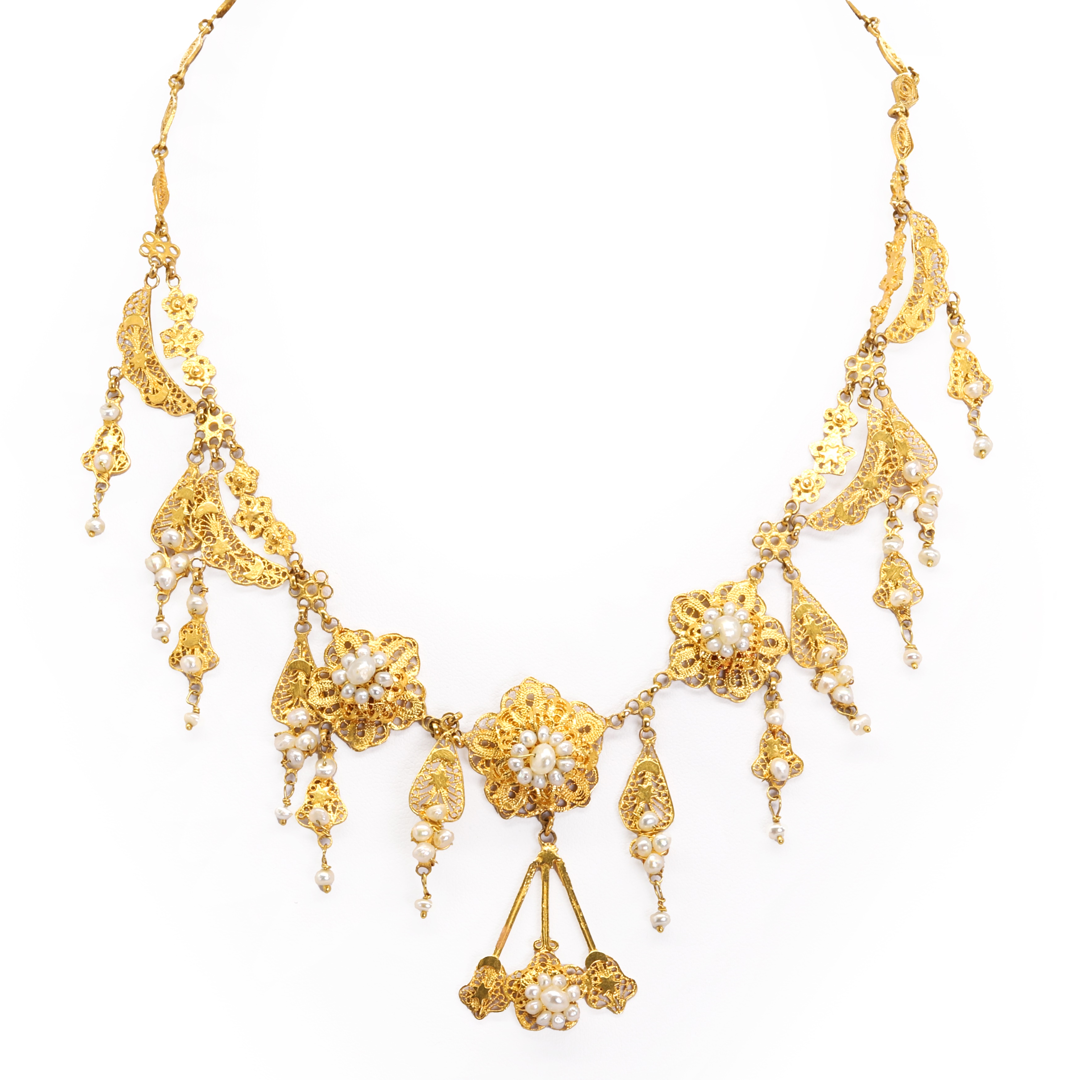 Lot 211 - A Middle Eastern gold and seed pearl